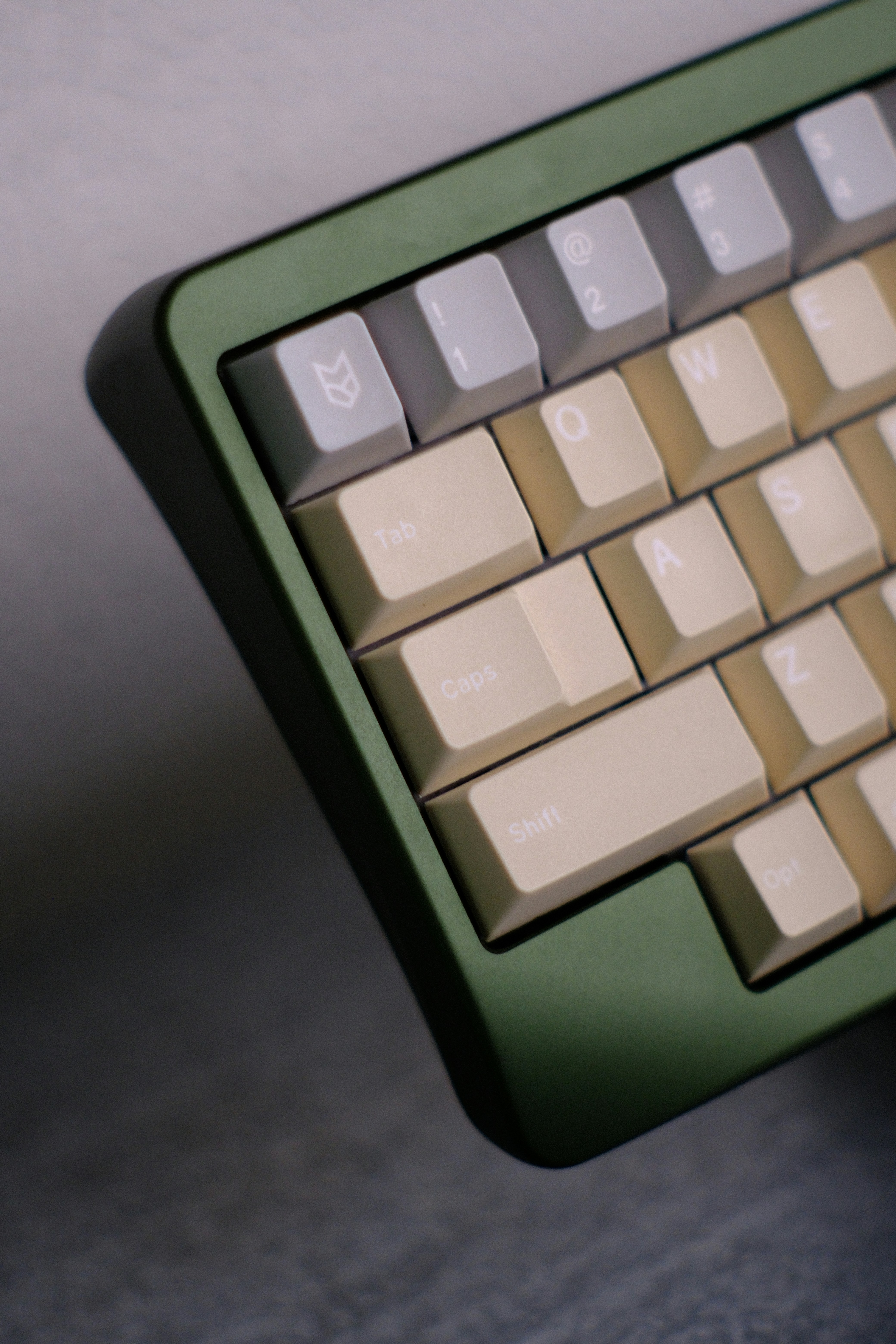 Green-framed keyboard corner in soft-focus portrait crop