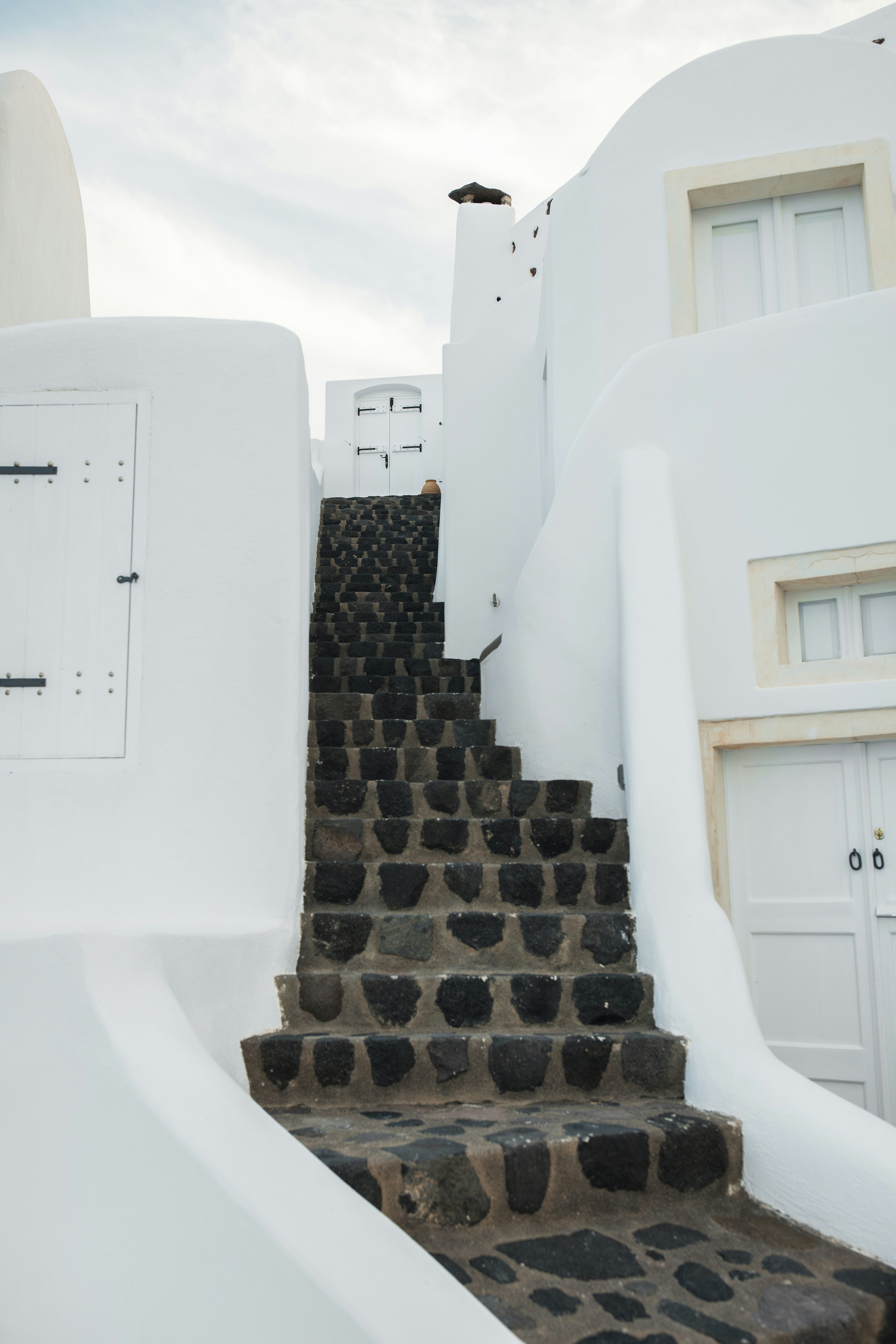 Stairway Between Whitewashed Walls to a Quiet Horizon