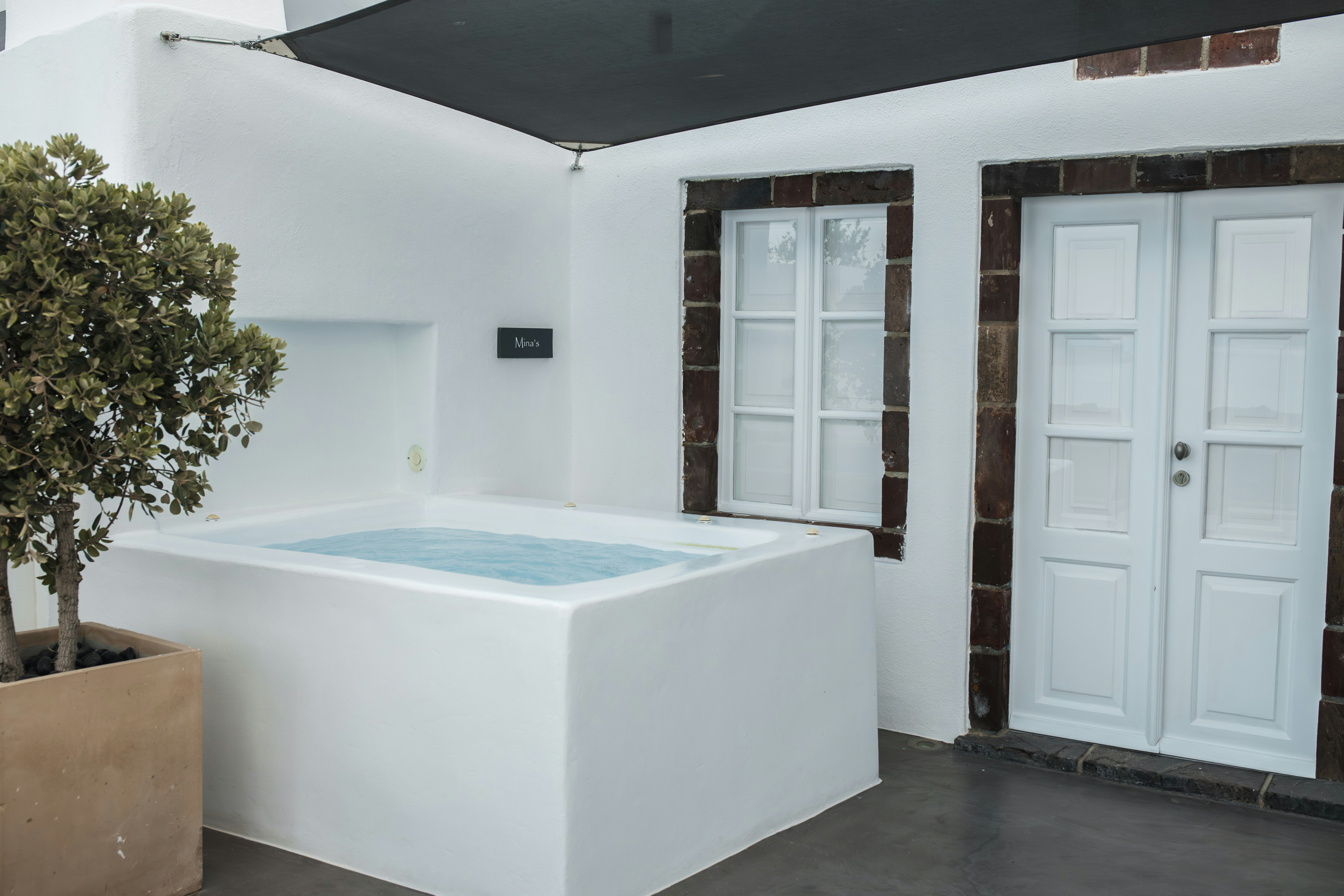 Minimalist Courtyard Oasis with Whirlpool and Whitewashed Walls