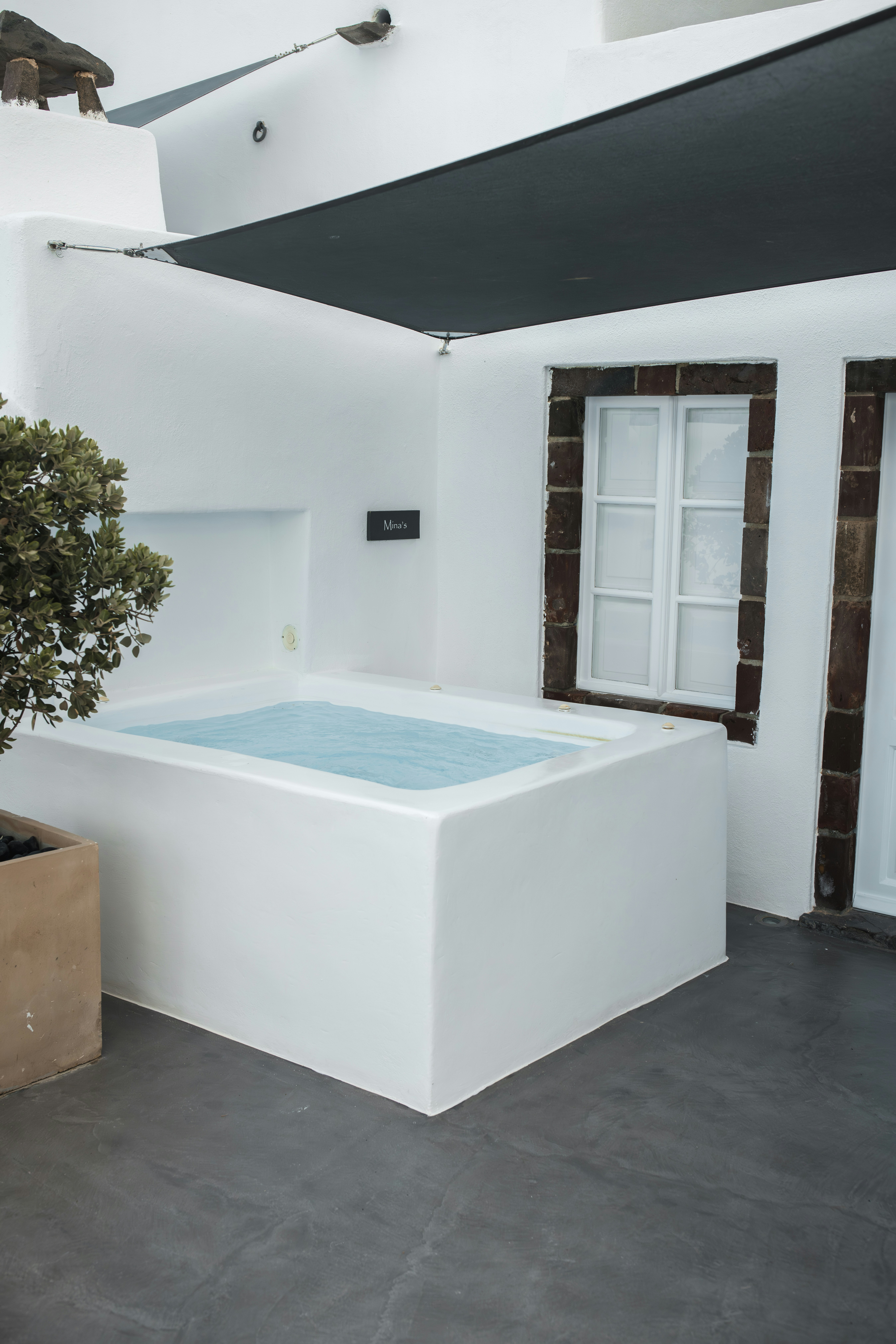 Whitewashed Minimalism: A Courtyard Oasis with a Compact Pool