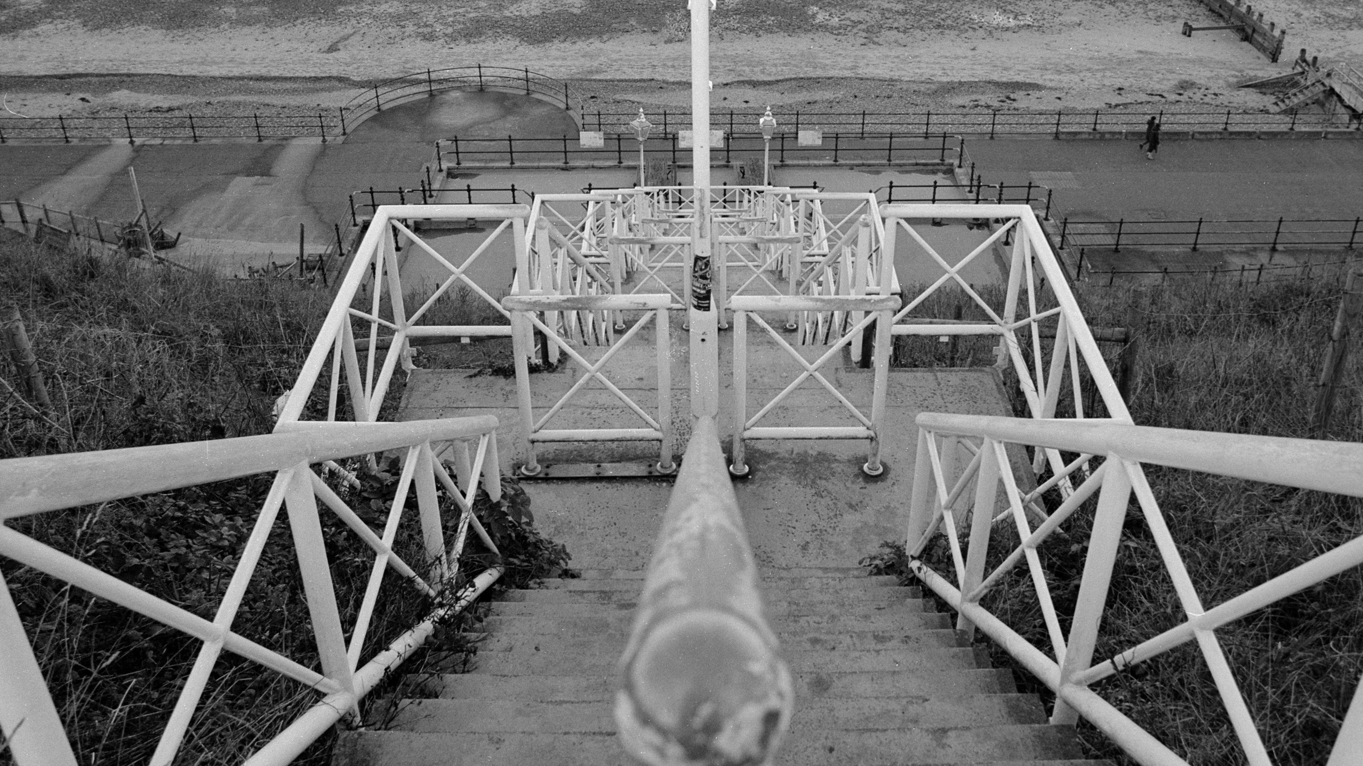Climb Toward the Pier: An Abandoned Stairway Leads to the Sea