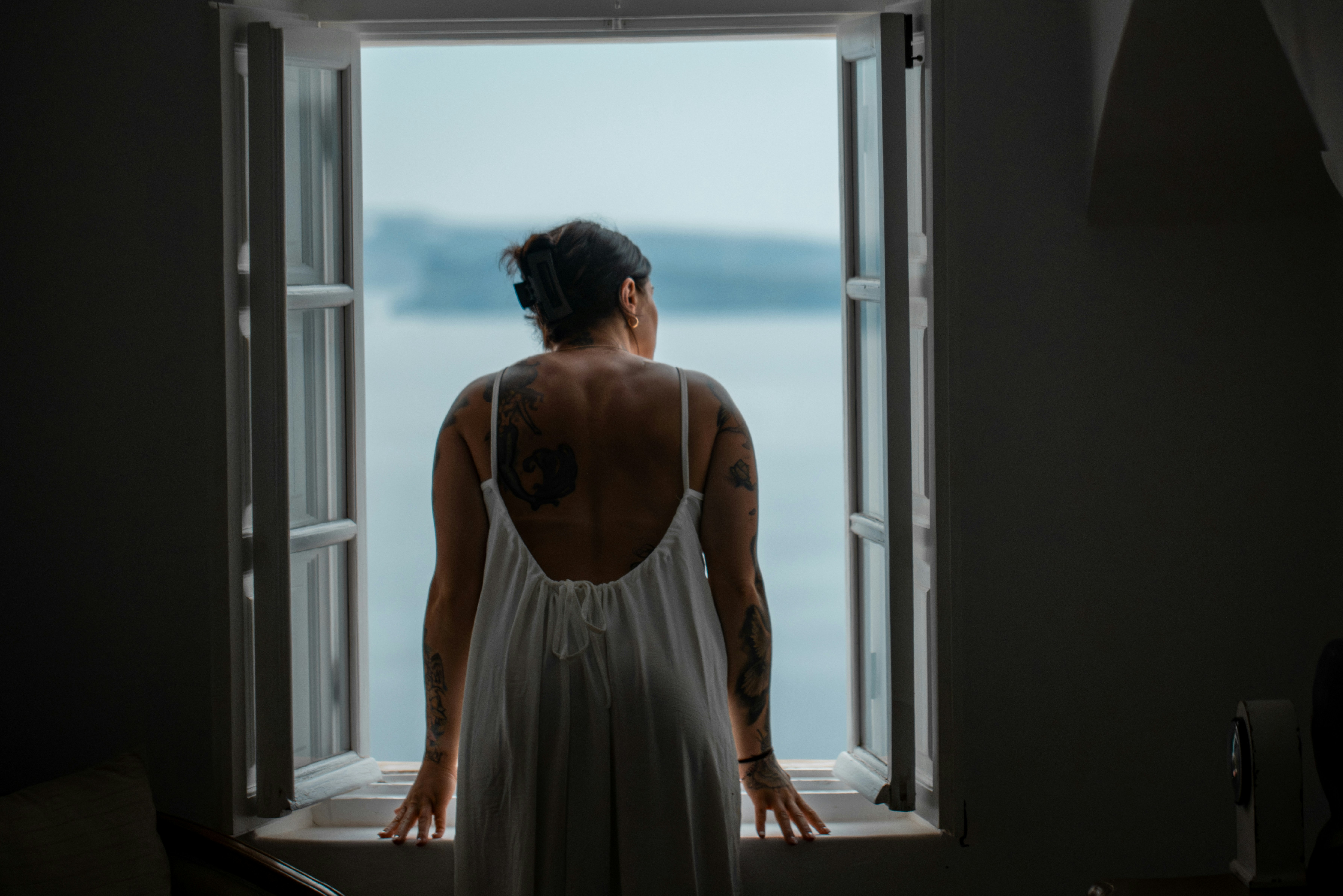 Windowed Solitude: A Back View at the Sea
