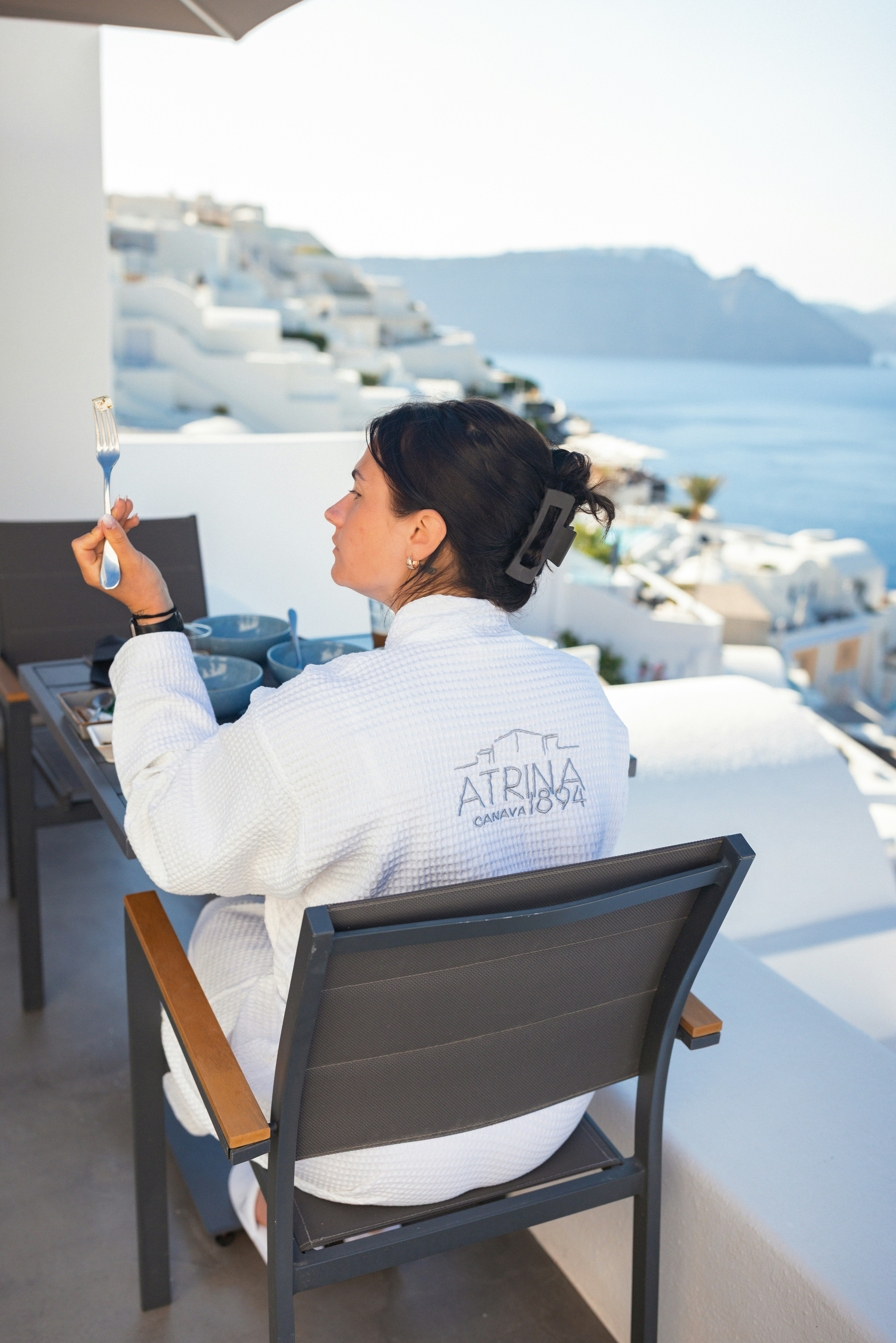 Dinner with a Sea View: Woman in White robe at an Aegean Terrace