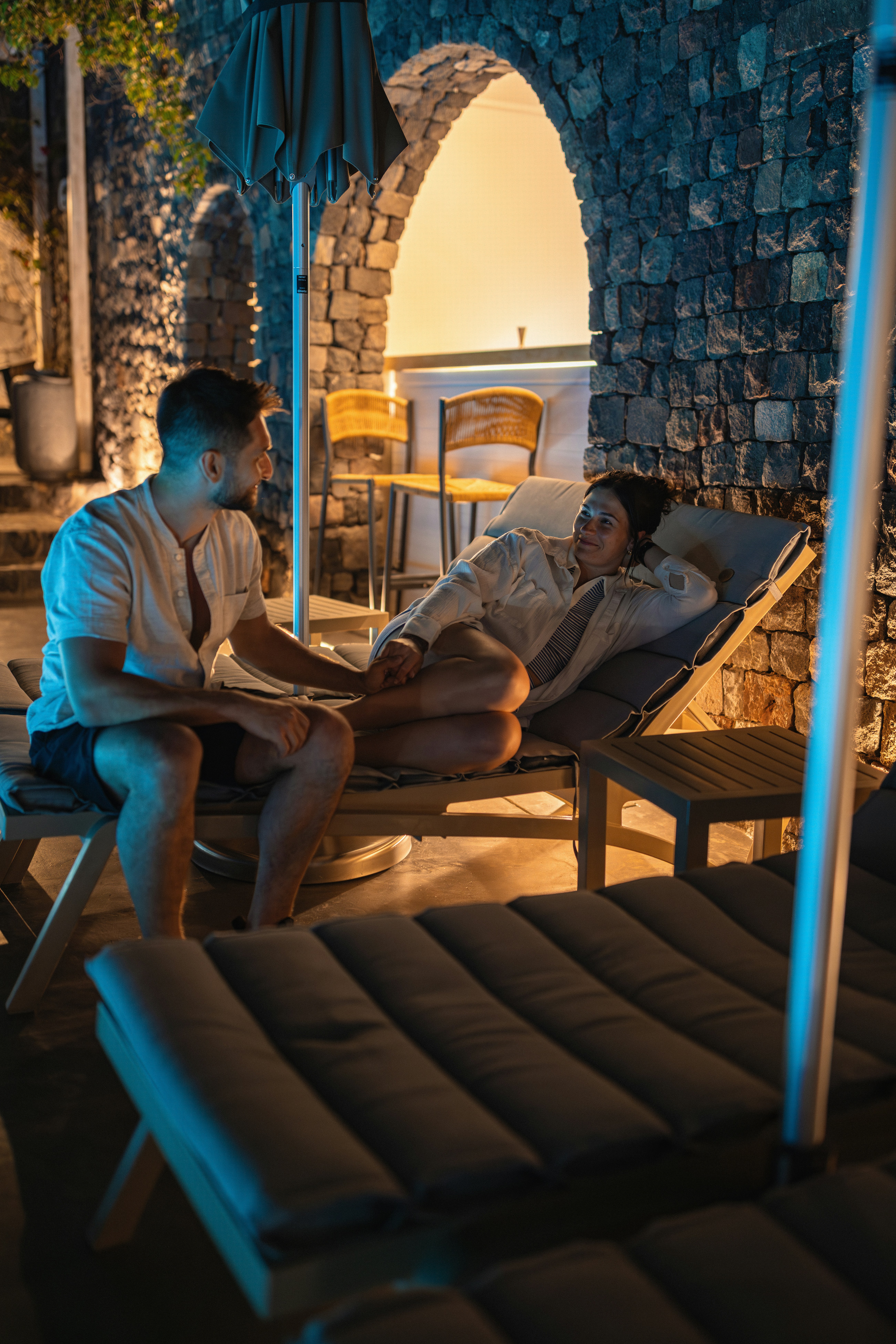 Quiet Conversation Under Evening Stone Arches