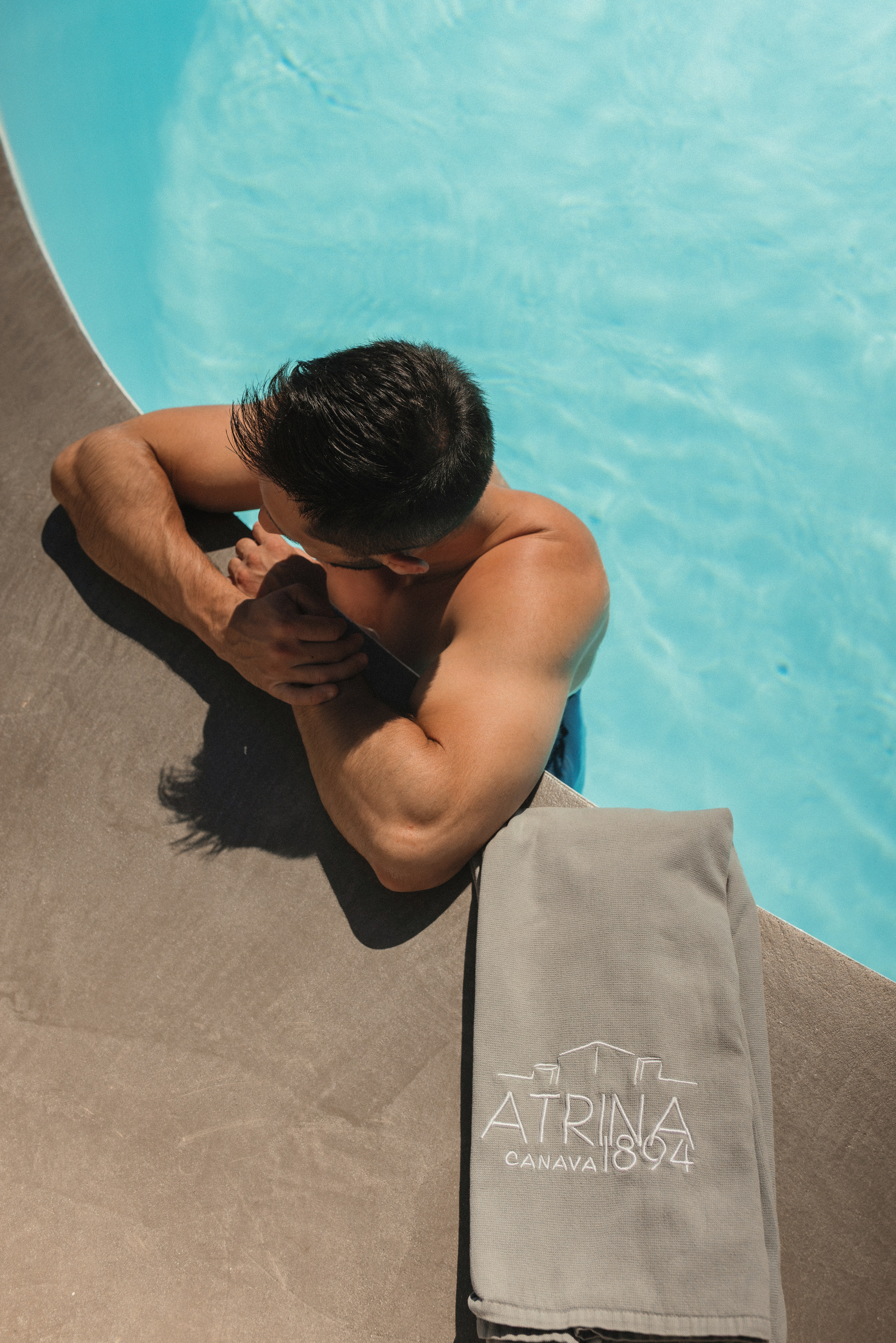 Locker-Top Pose by the Pool: A Summer Rest by the Water