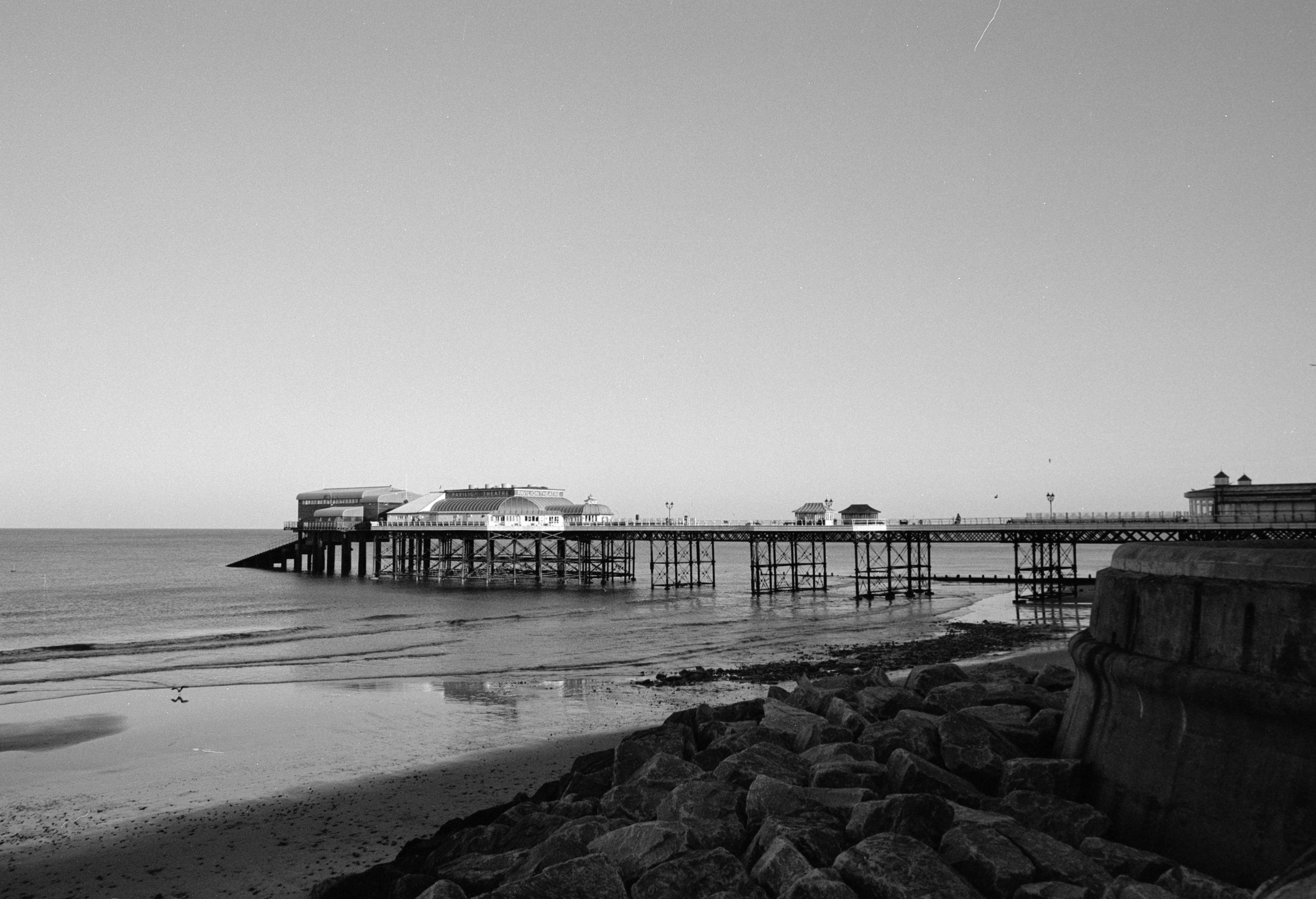 Pier Silhouette over Quiet Tide