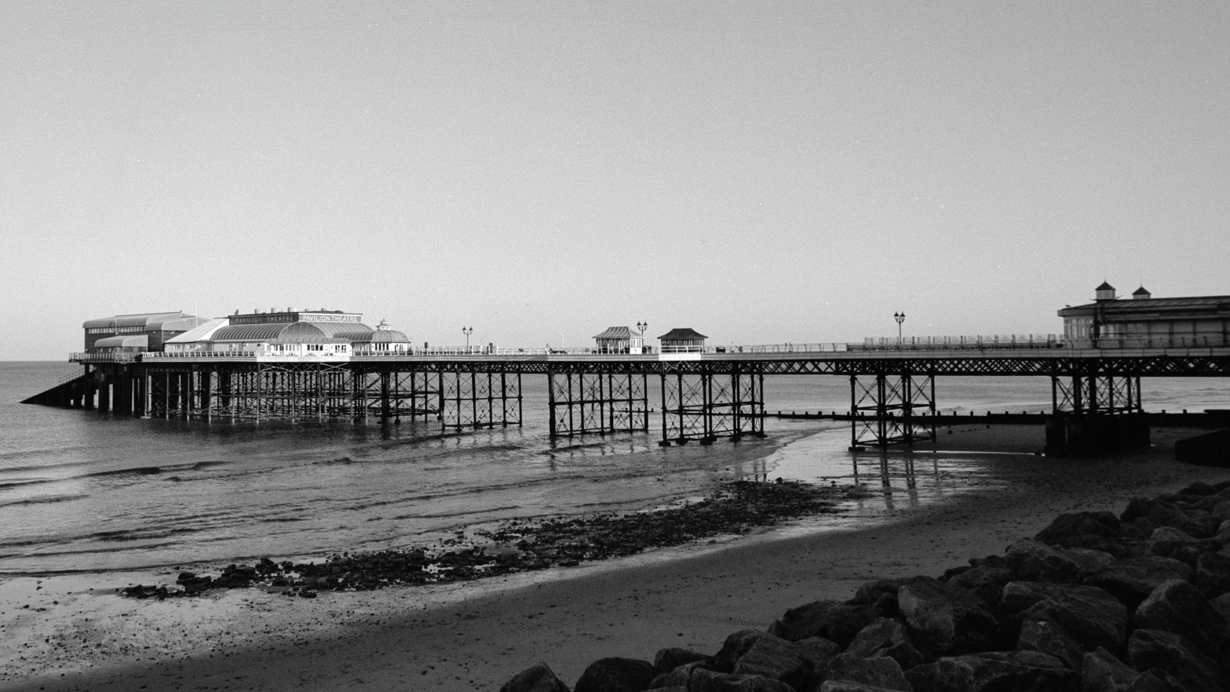 Pier at Dusk: A Quiet Wake of Steel and Tide