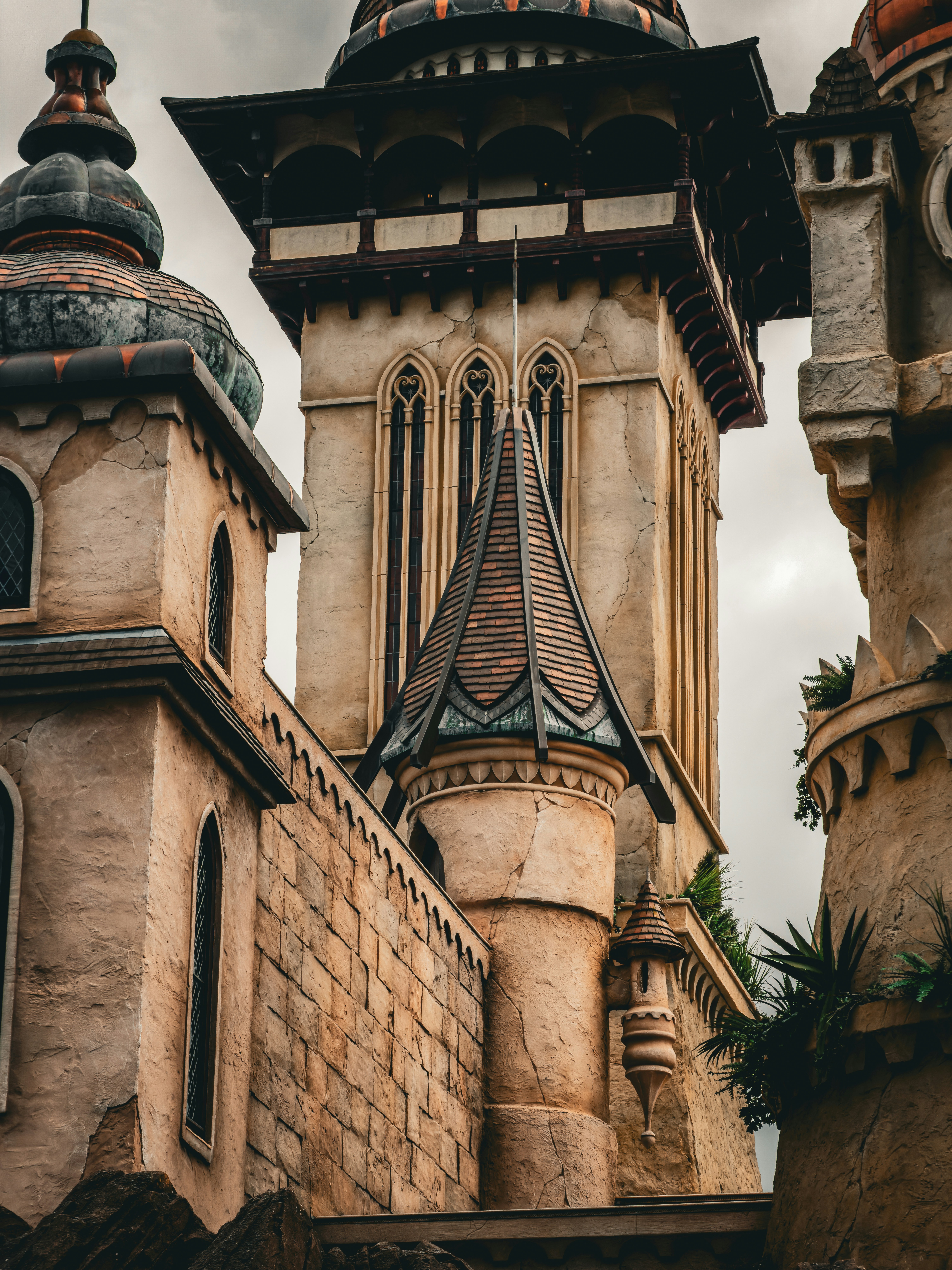 Castle Spires and Turrets: A Timeless Facade Rising into Stormy Skies