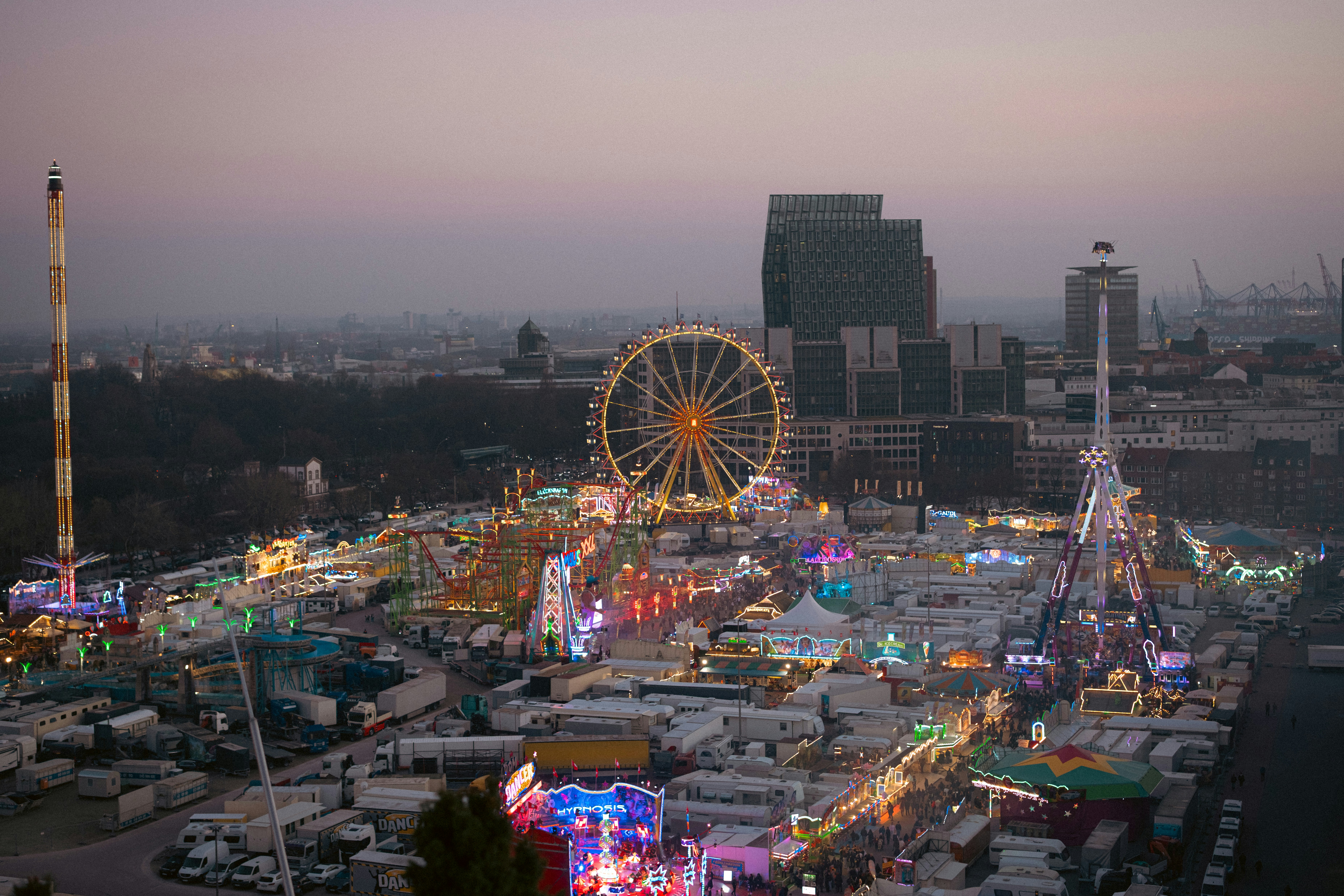 Midnight Carousel Echoes: A City Fair Illuminated from Above