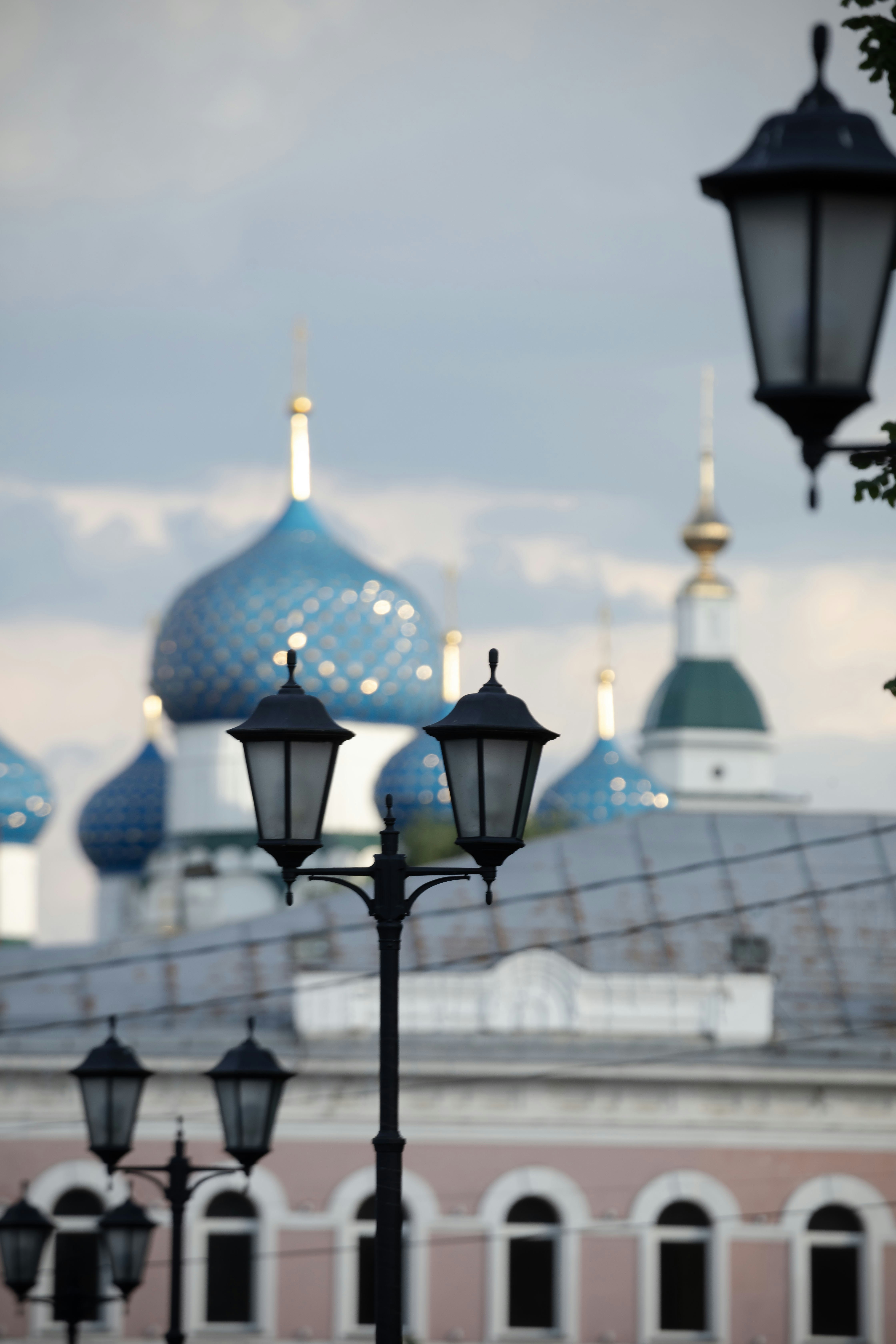 Central Streetlamps Framing the Blue Onion Domes