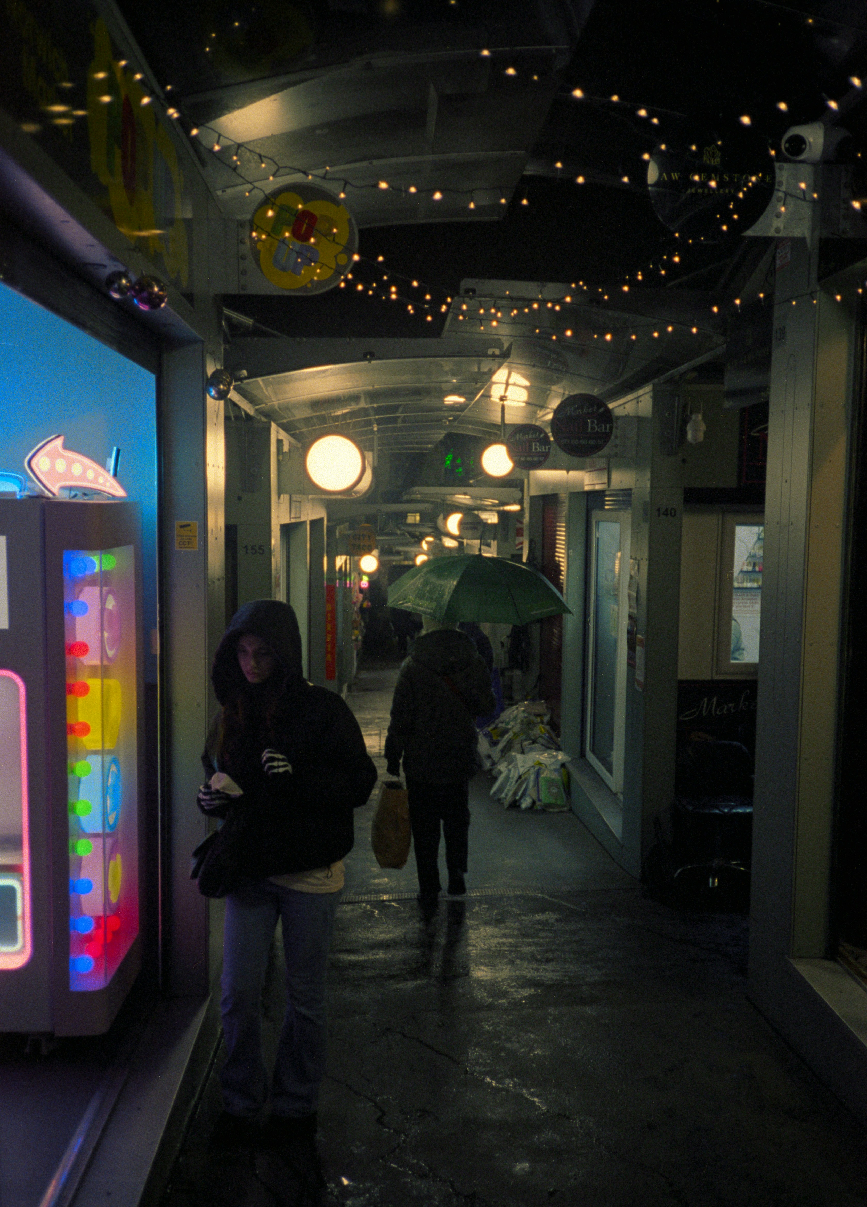  Neon Alley: Night Market Corridor with Figures in Shadow