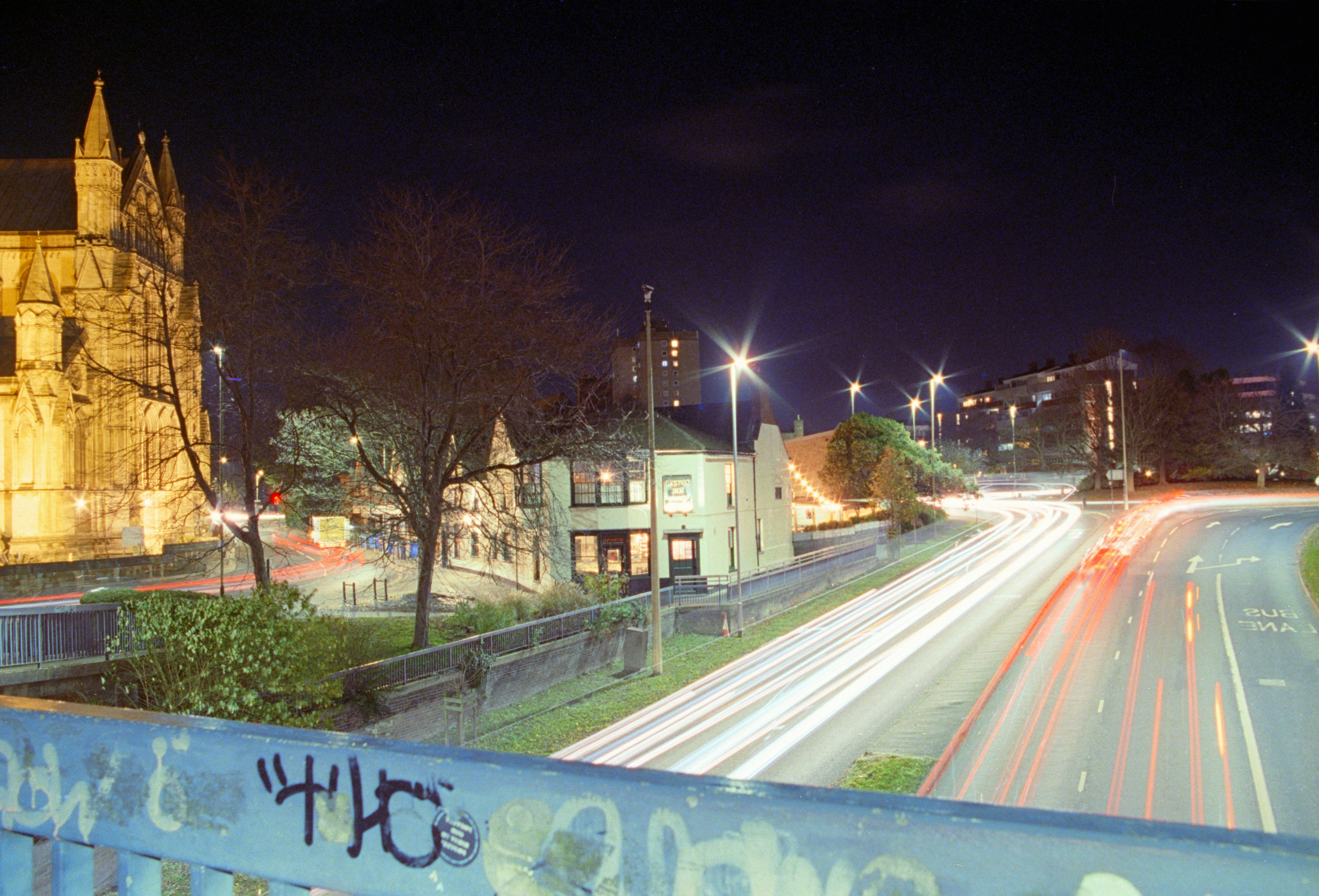 Night Highway Overpass: Long-Exposure Glow Through a City