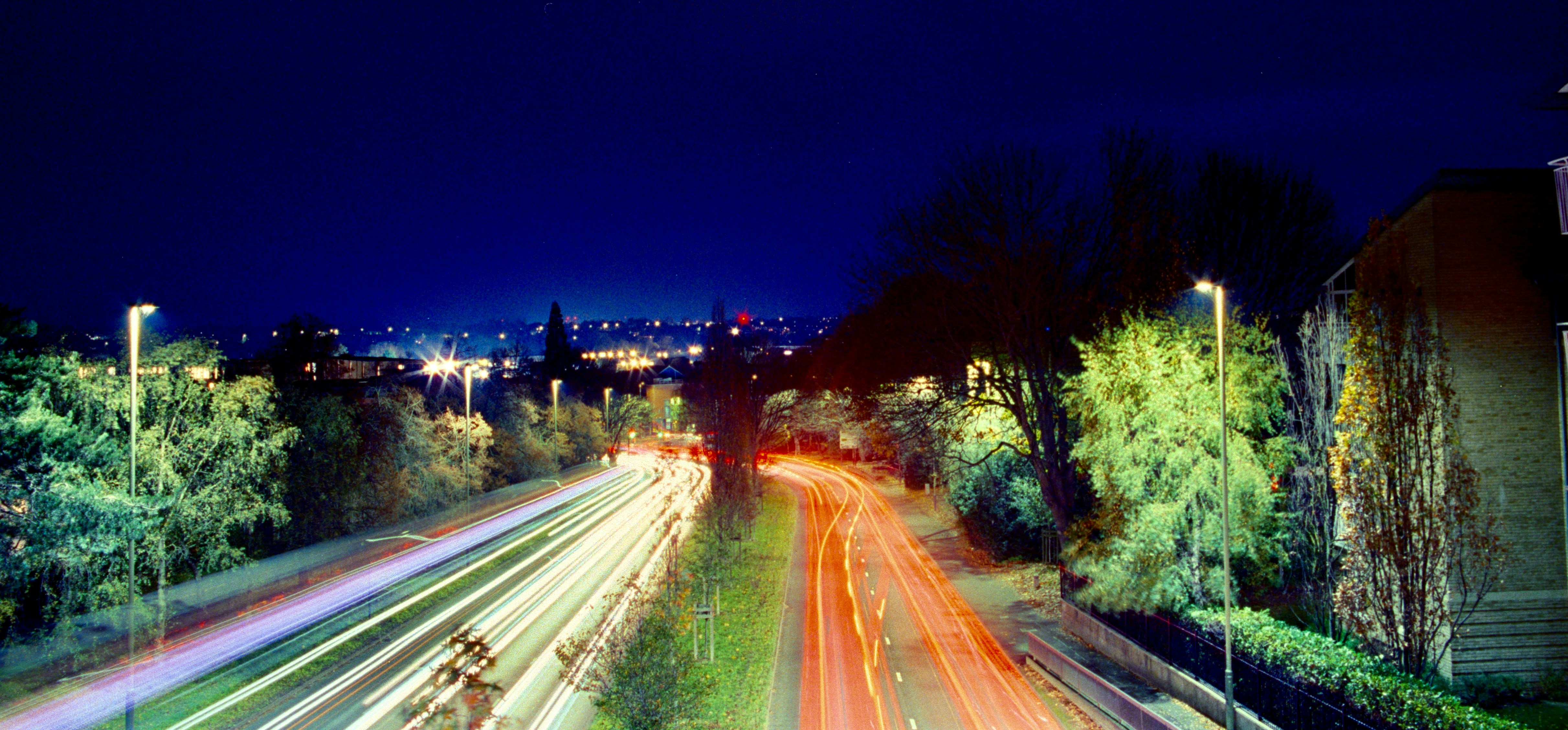Night Corridor: Light Trails Through a Quiet City Arc