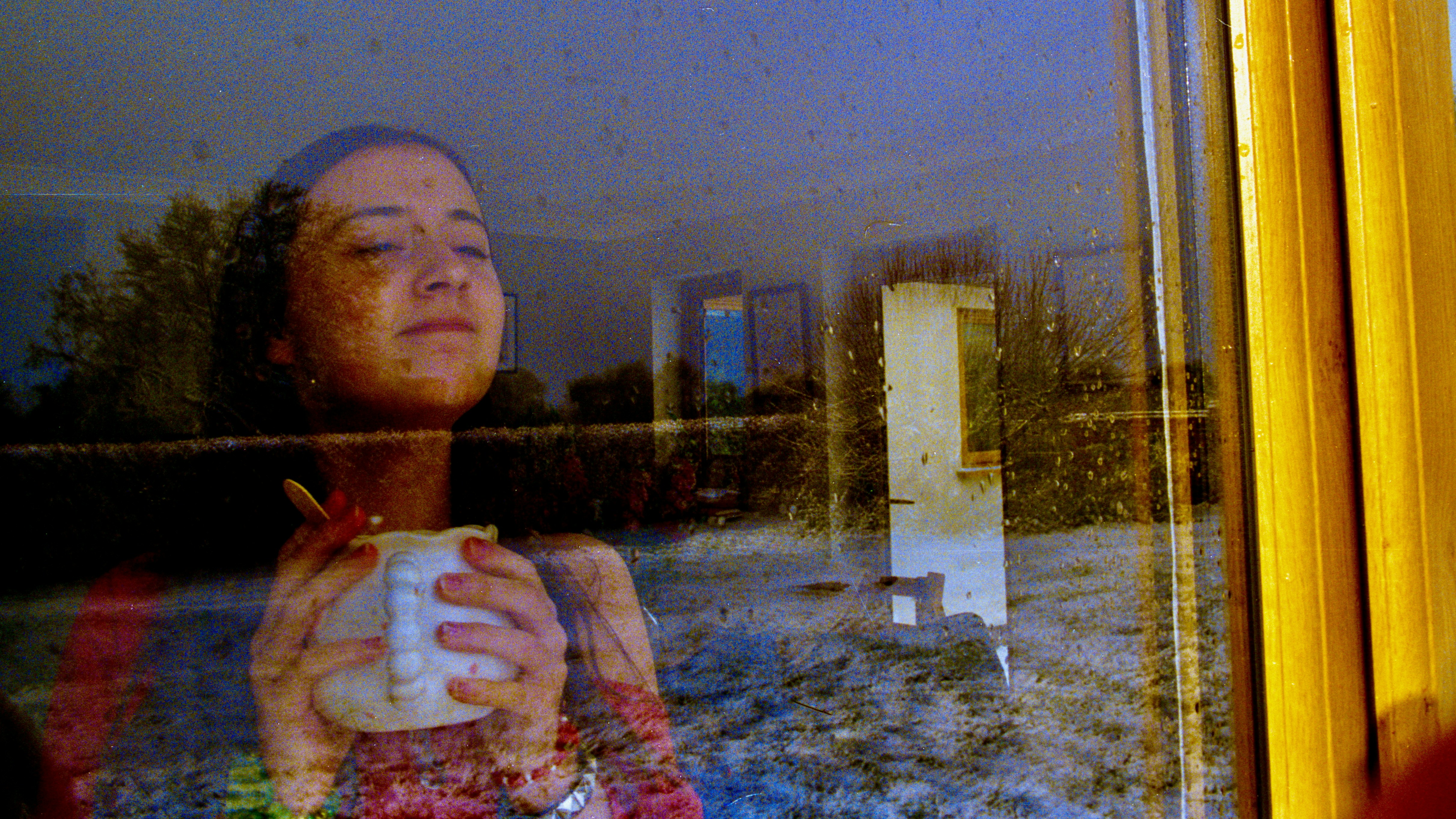 Window Reflections: Quiet Portrait Amid Winter Light