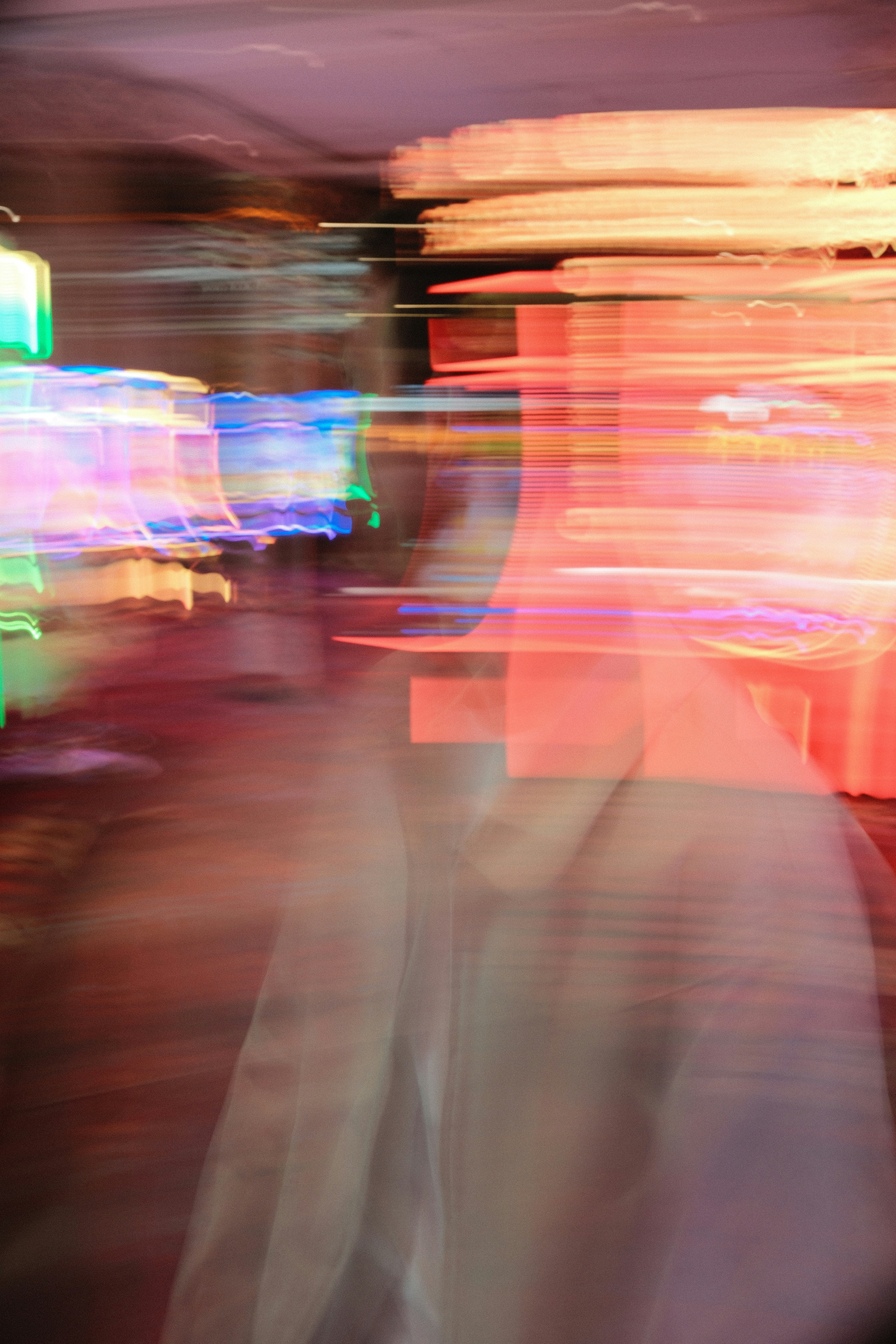 Abstract blurred lights and colorful streaks create a dynamic background.