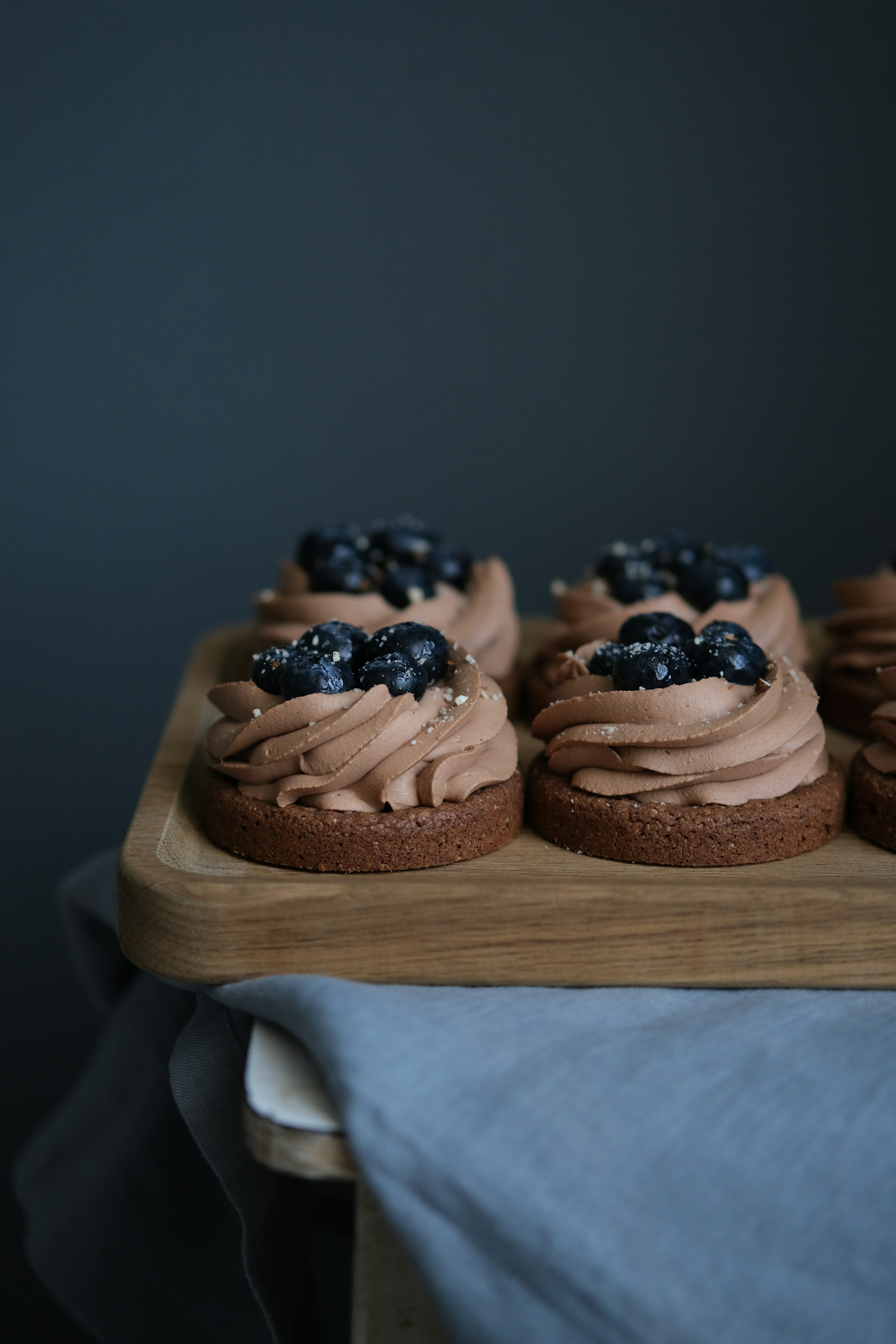 Chocolate Whirl: Mini Tarts with a Whisper of Cocoa and Blueberry Night