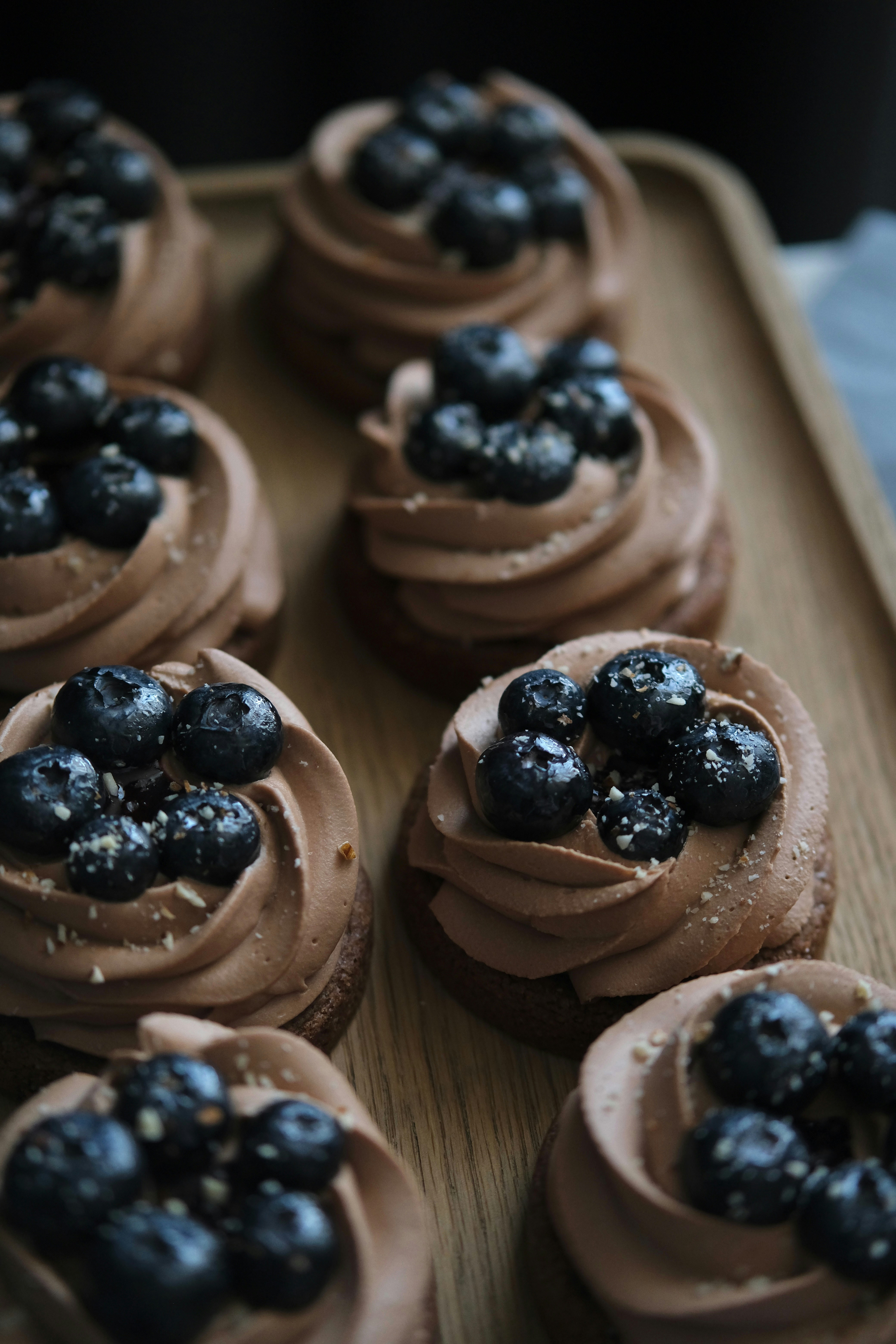 Twilight Cocoa Minis: Chocolate Cupcakes with Blueberry Crowned Swirls
