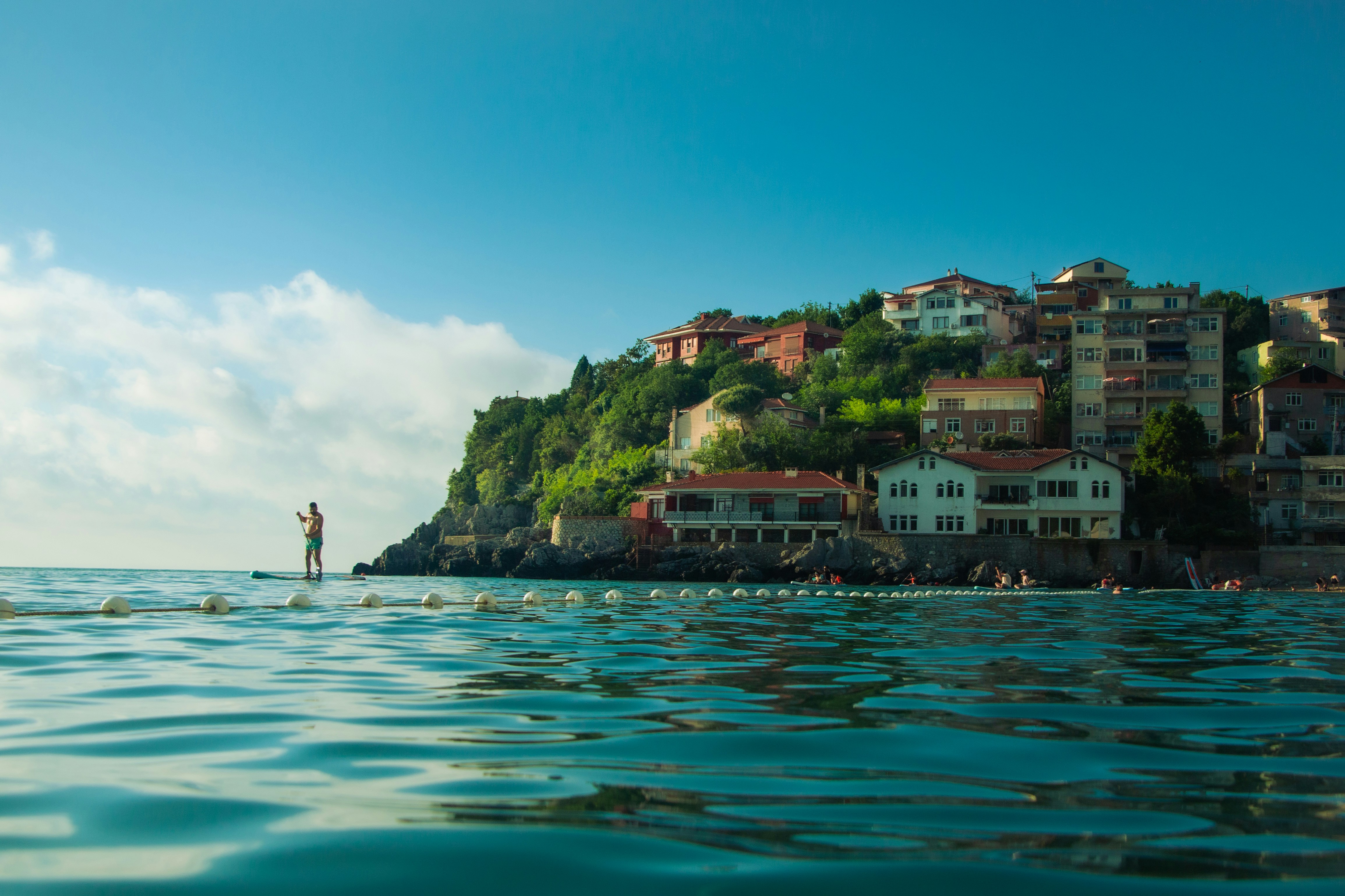 Lone Surfer at the Cliffside Village