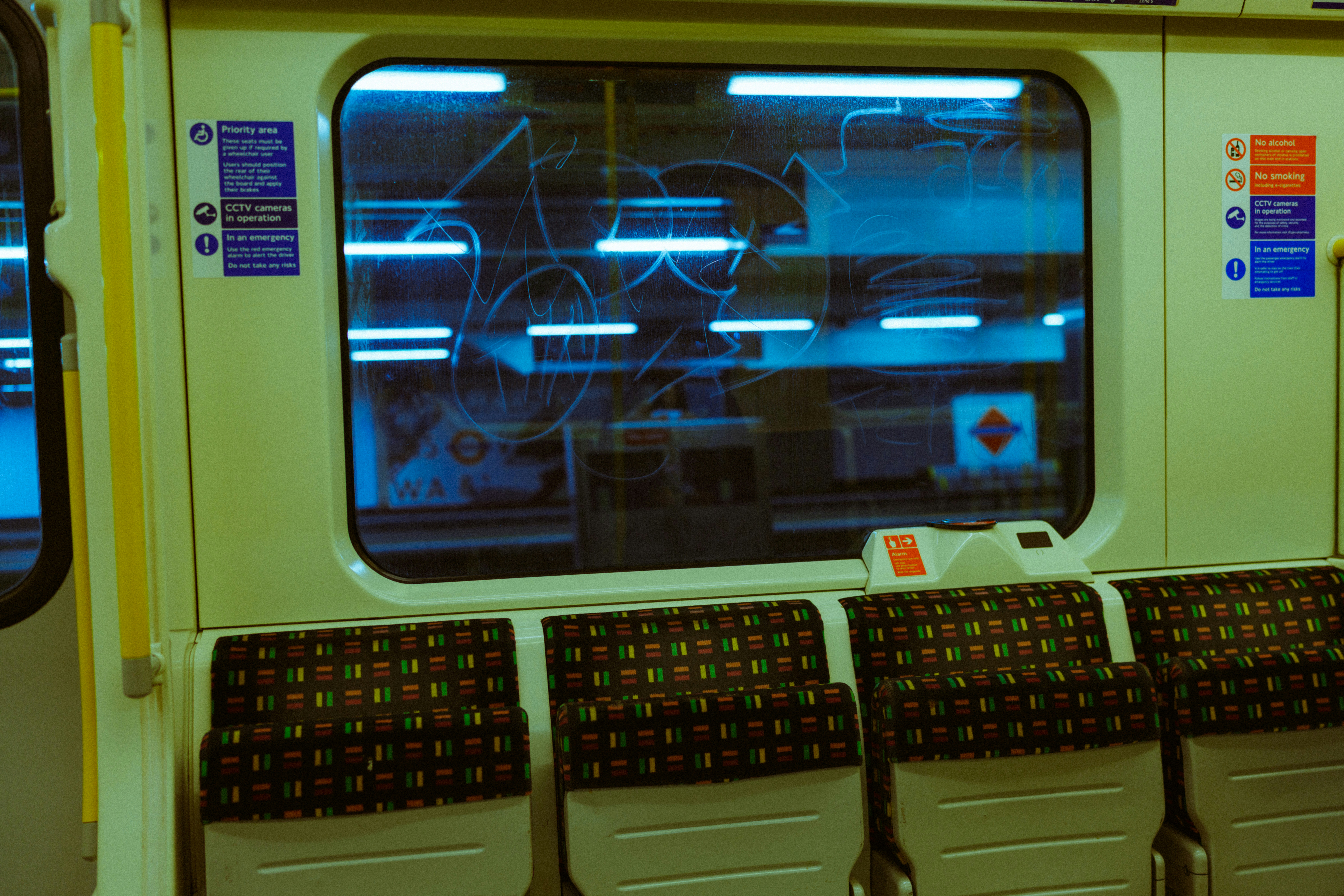 Neon Reflections in a Subway Car