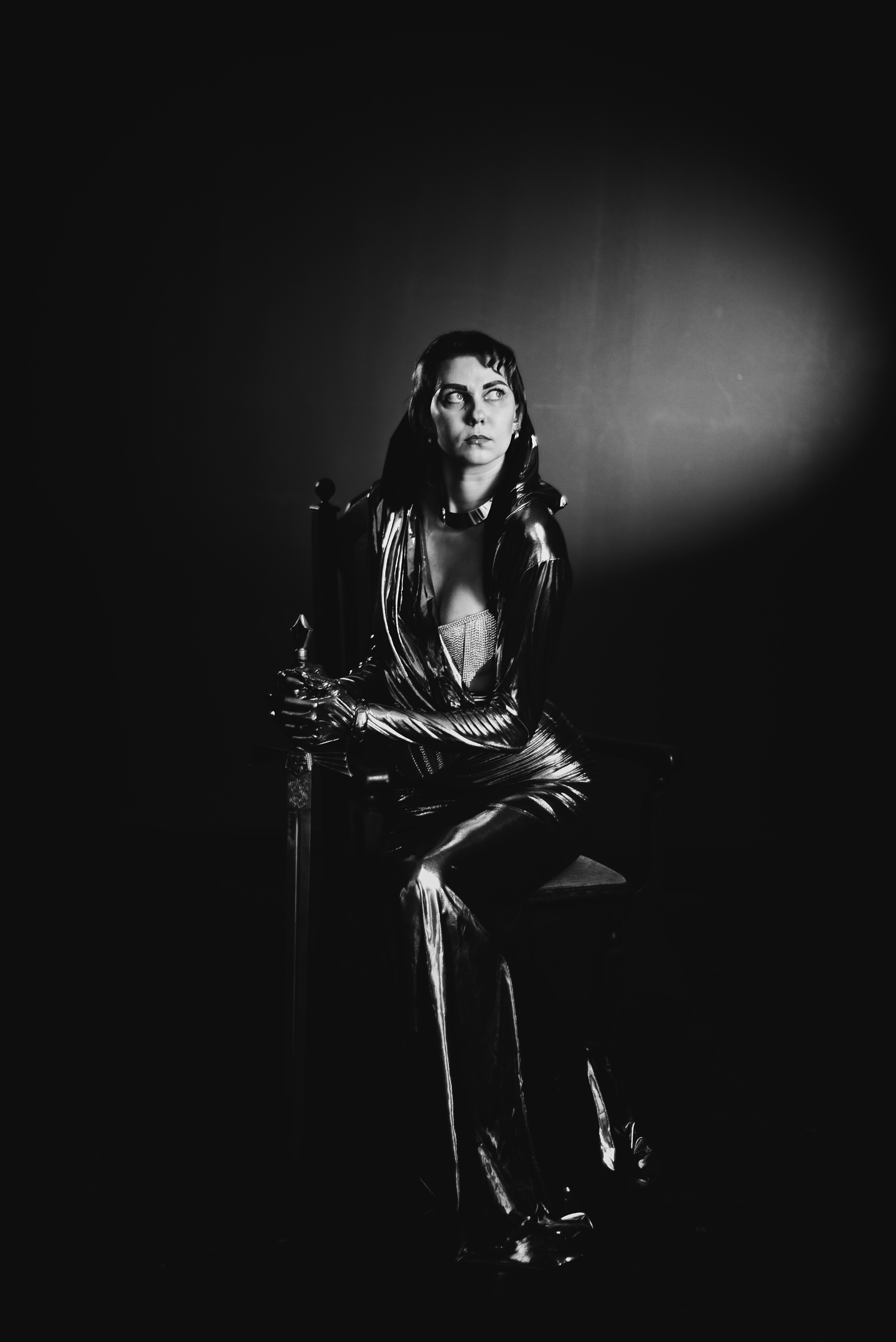 Moonlit Velvet: A seated portrait in silver tones
