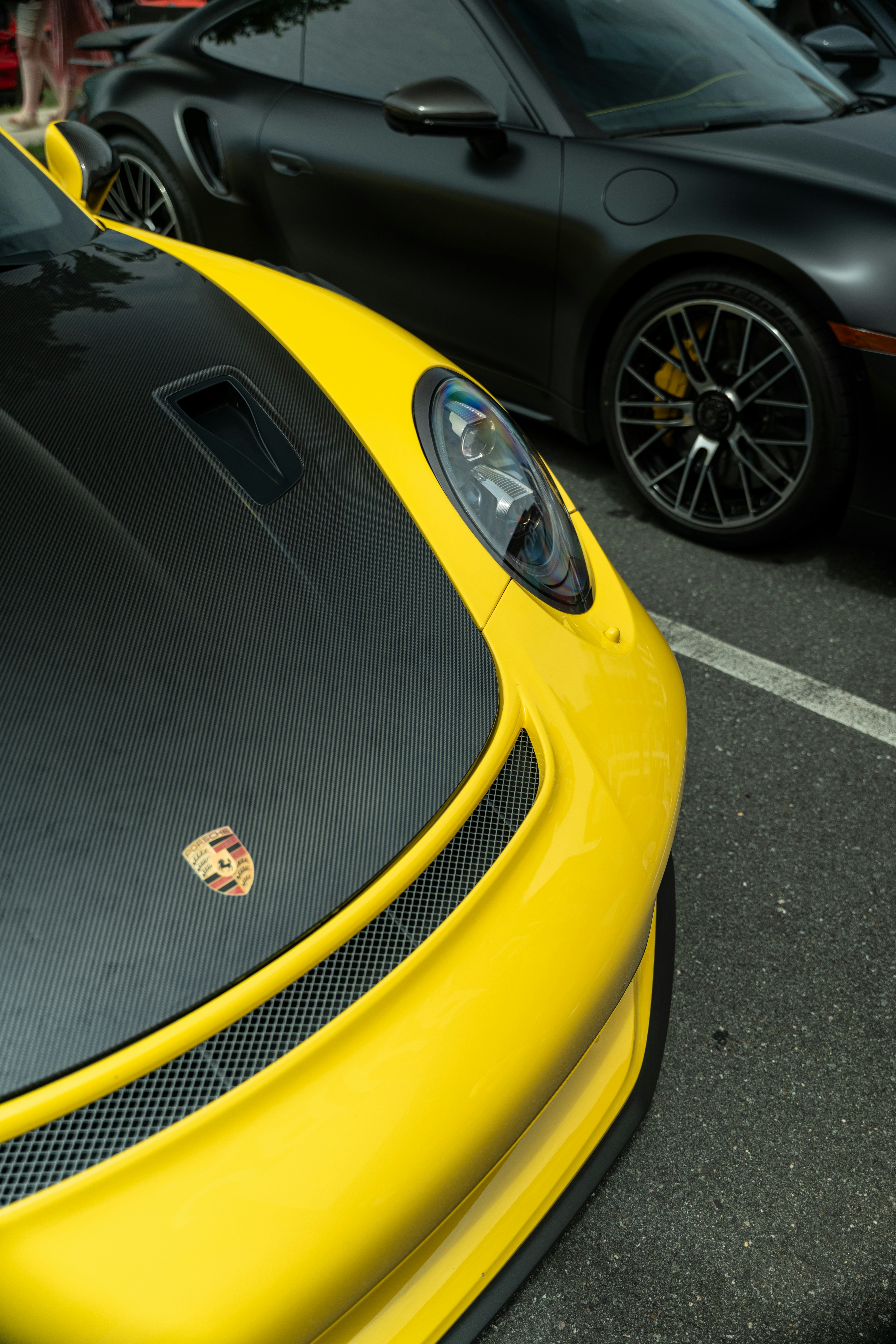 Yellow Velocity: A Peek at the Front End of a Porsche Face-off