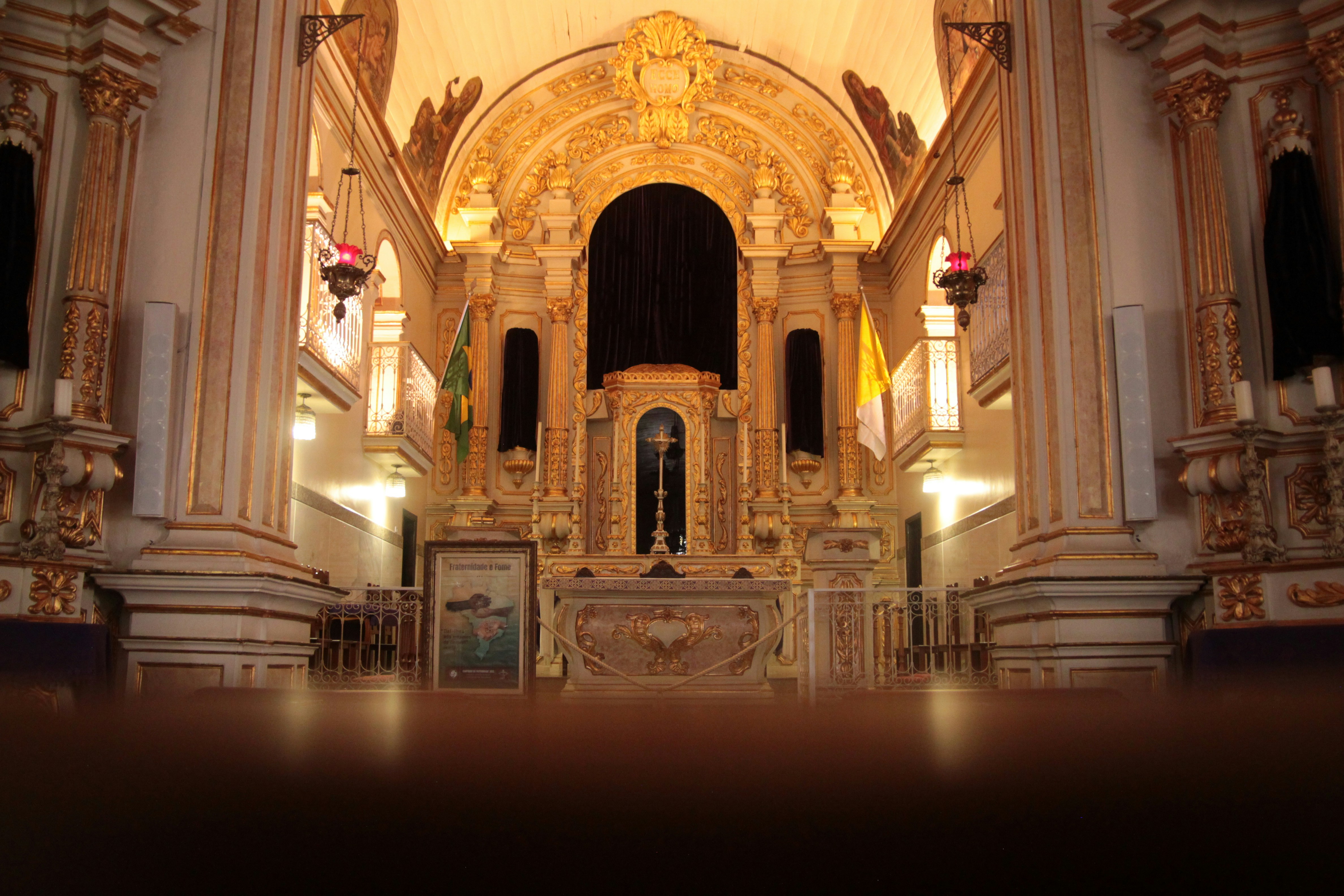 Ornate Church Altar Aglow: Baroque Grandeur at Dusk