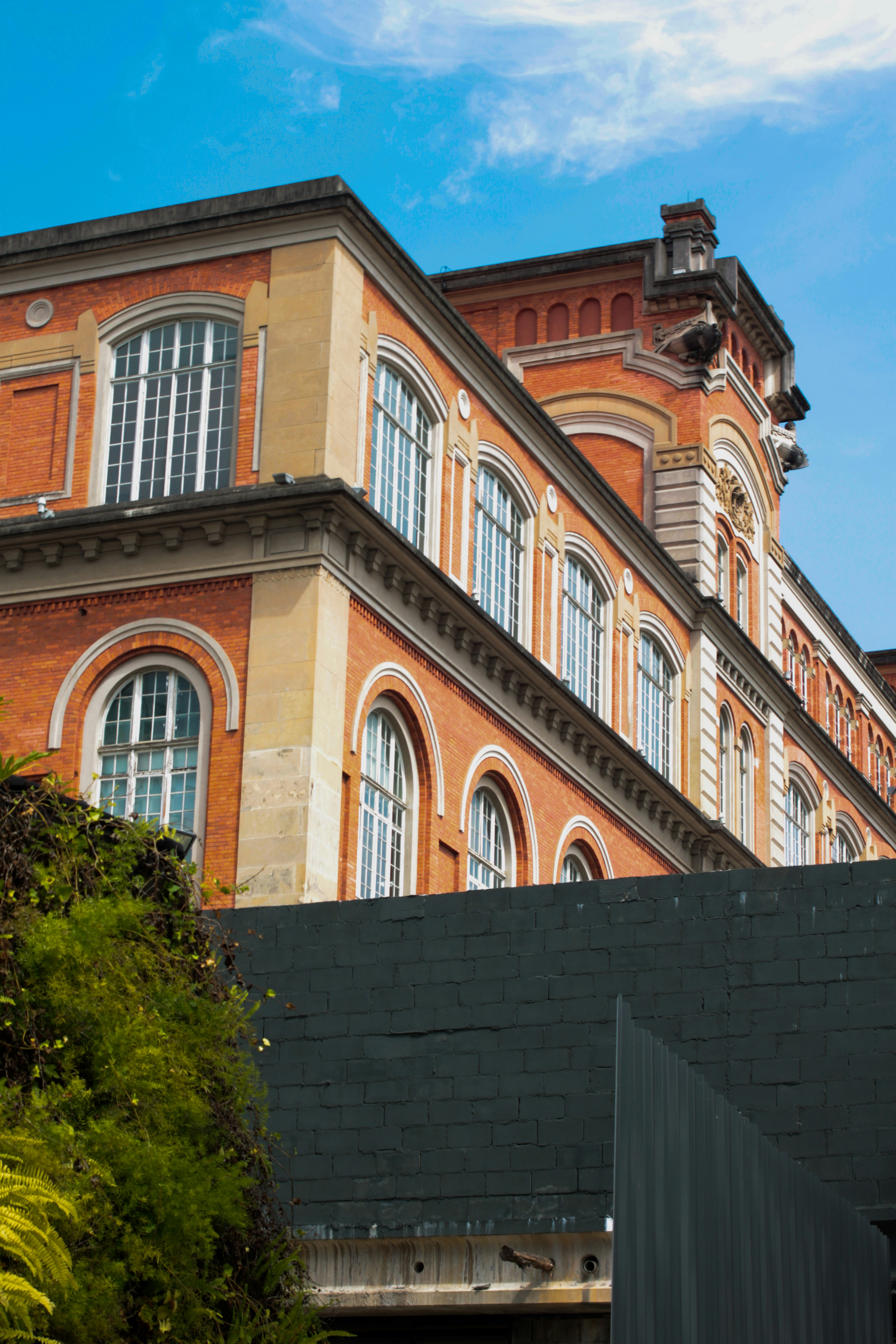 Corner of Brick and Sky: Historic Archways Against a Clear Blue