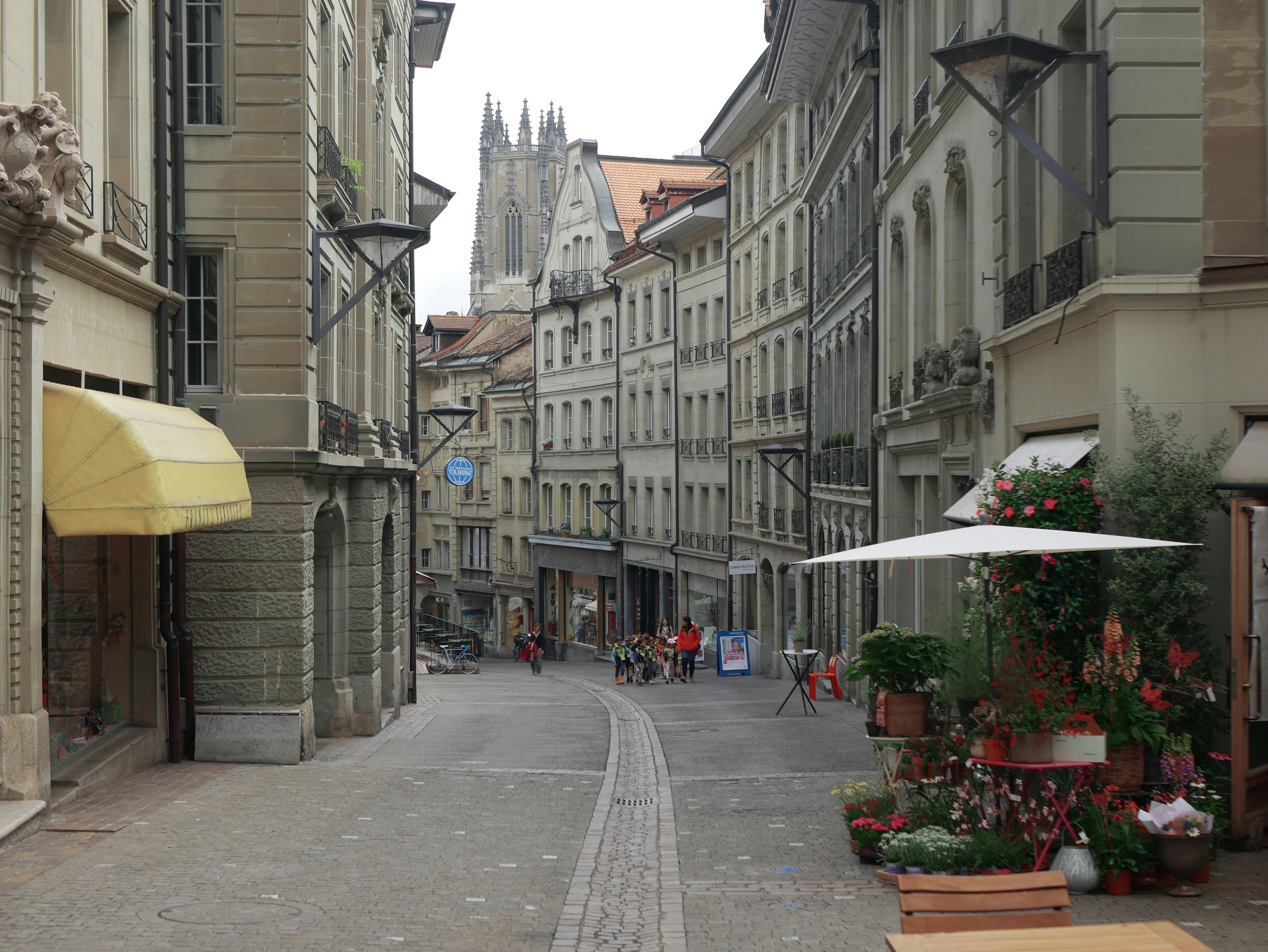 Cobbled Street Corridor Toward the Gothic Facade