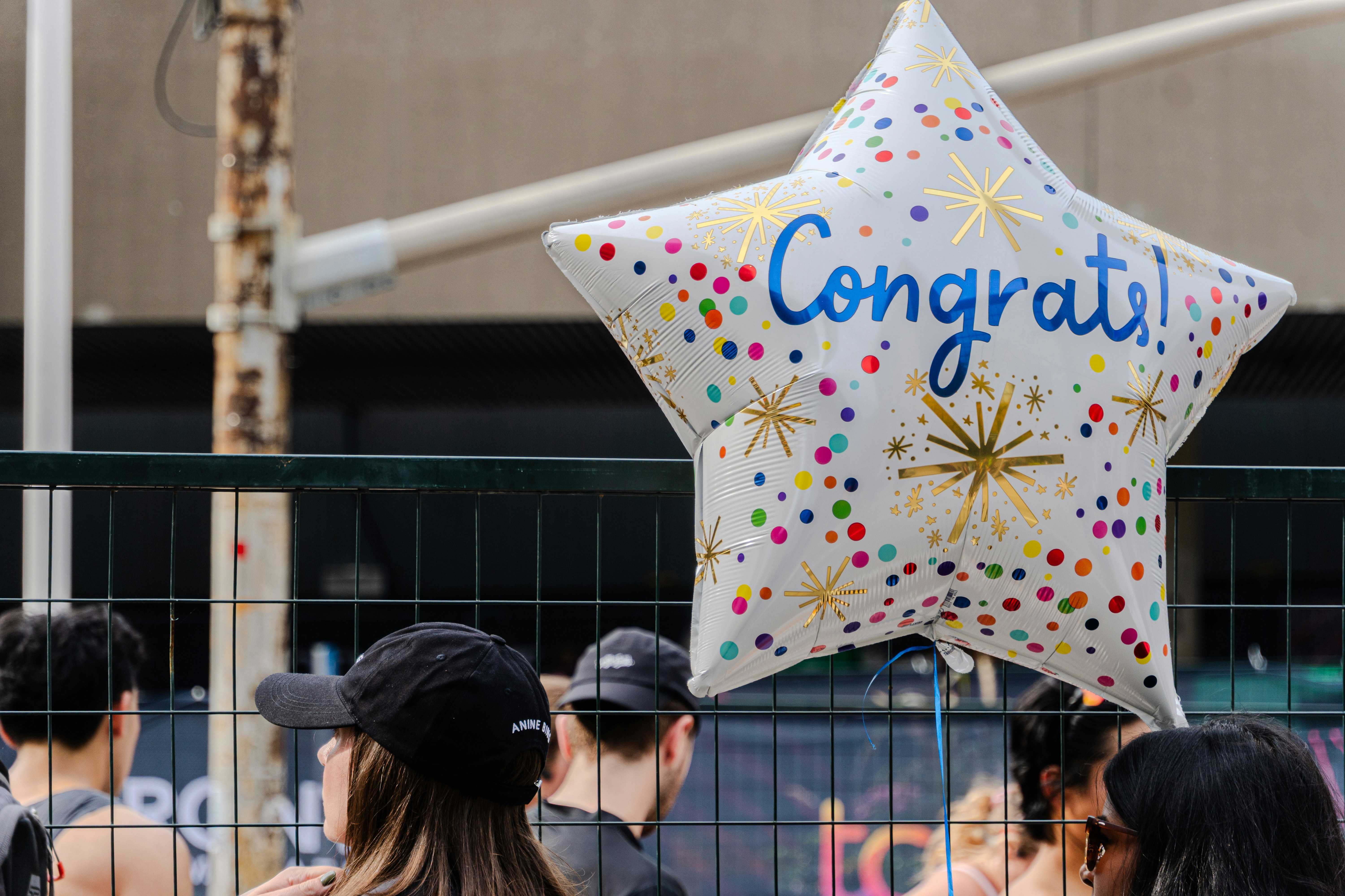 Congrats! A Festive Globe of Celebration Over a Crowd