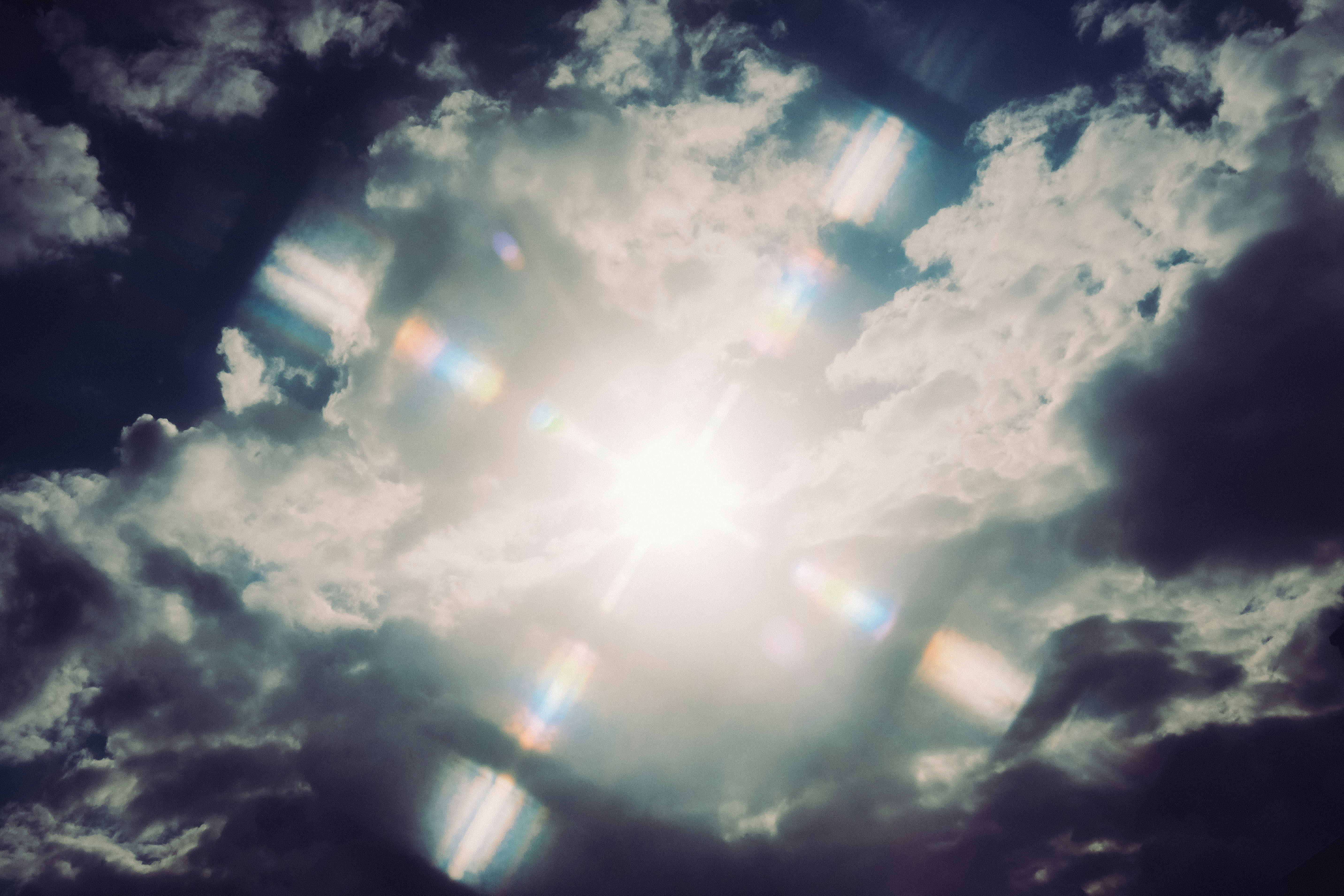 Sunburst Through Clouds: Prism Effects Across the Sky