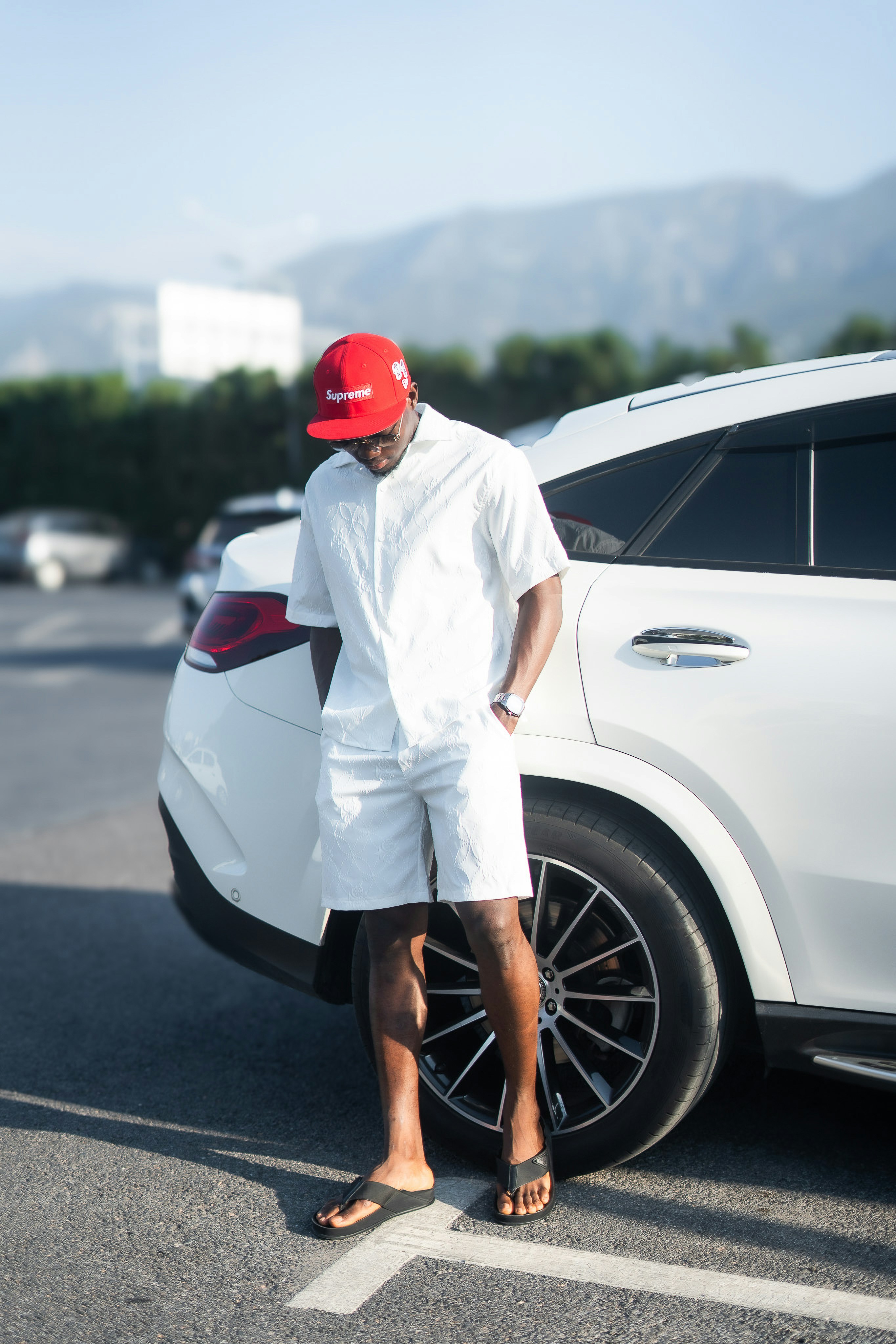 In White and Red: A Casual Stroll by the Car