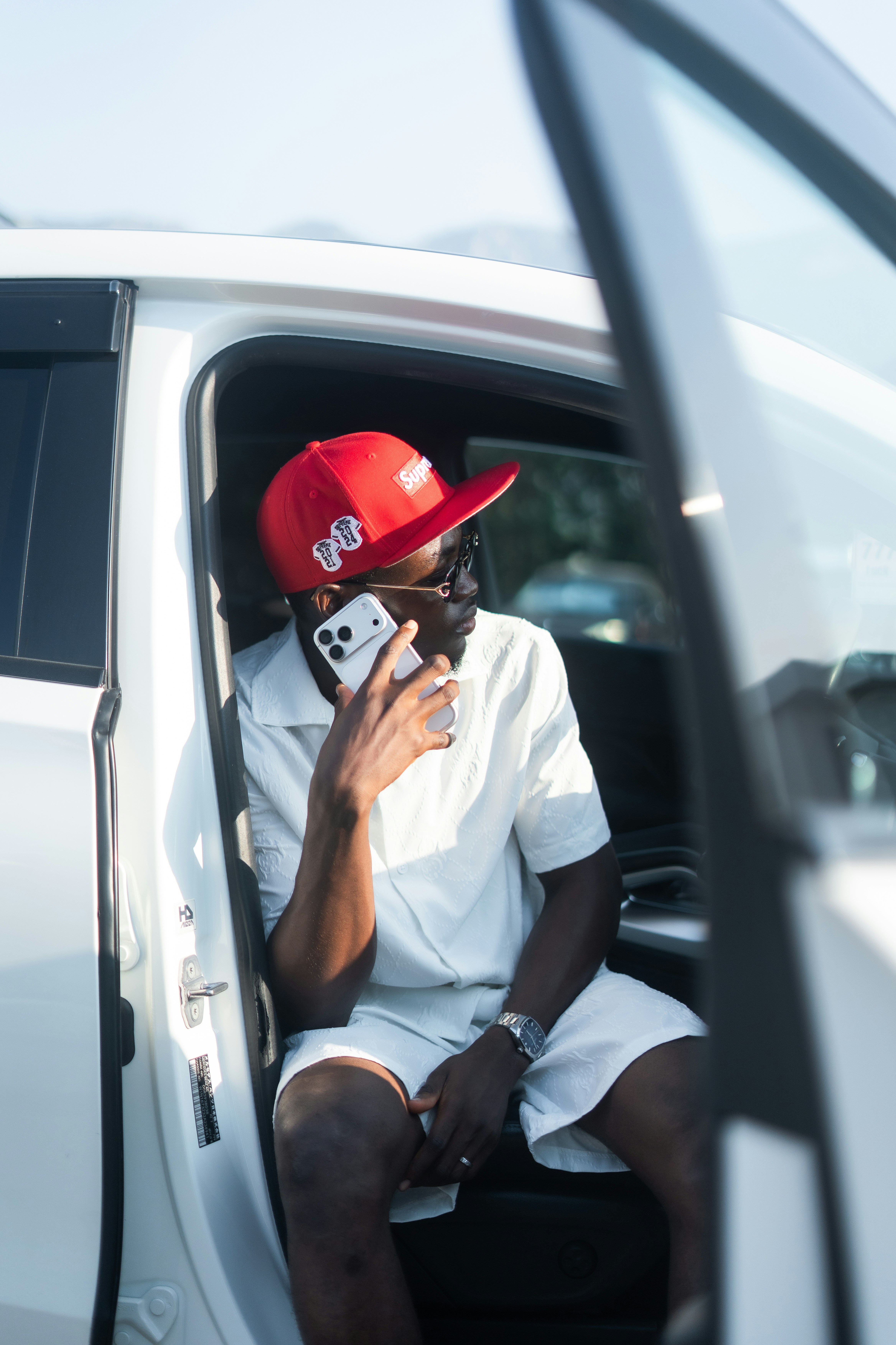 Masked in Red: a mobile moment inside the white pickup