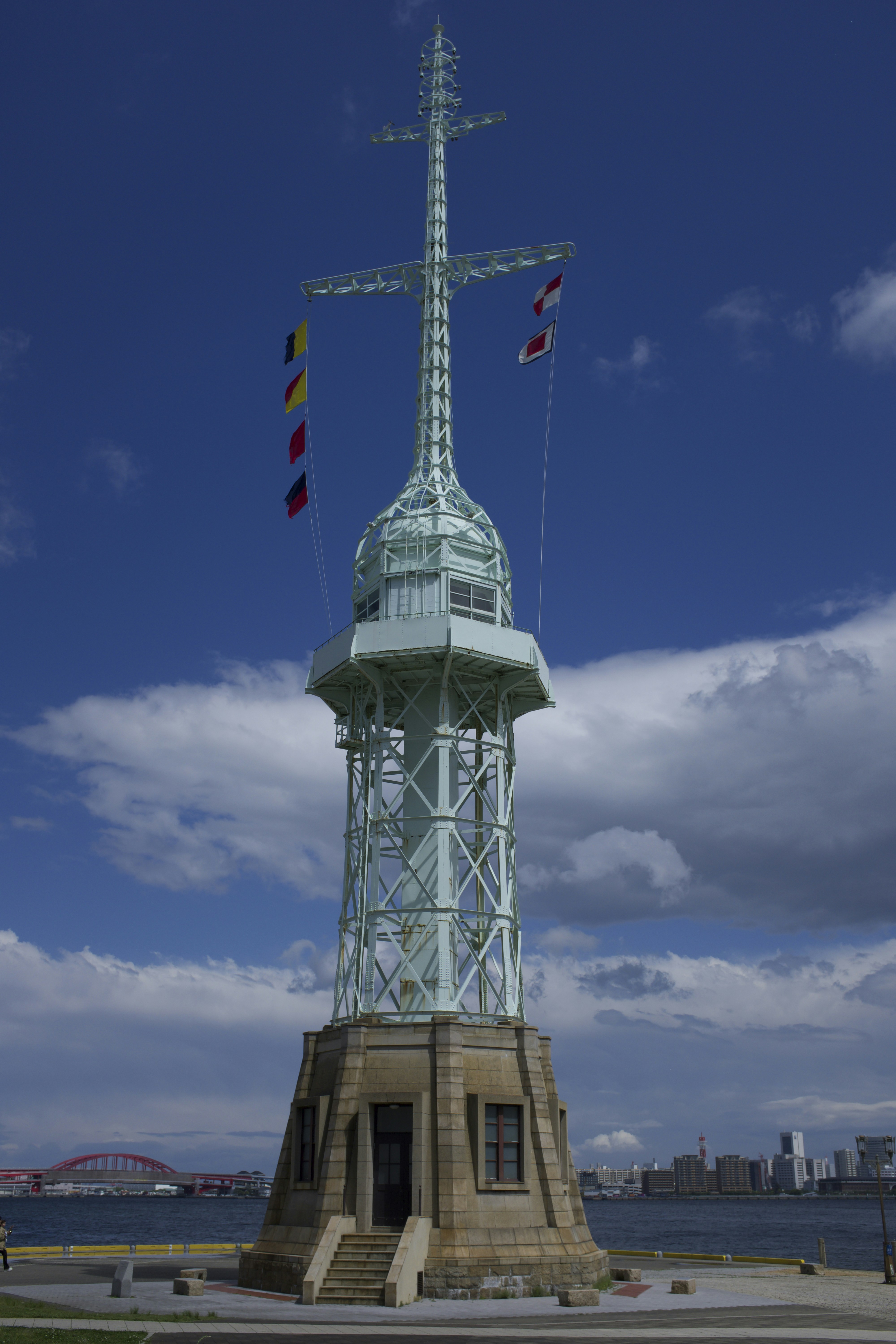 Towering beacon of metal and sky by the waterfront