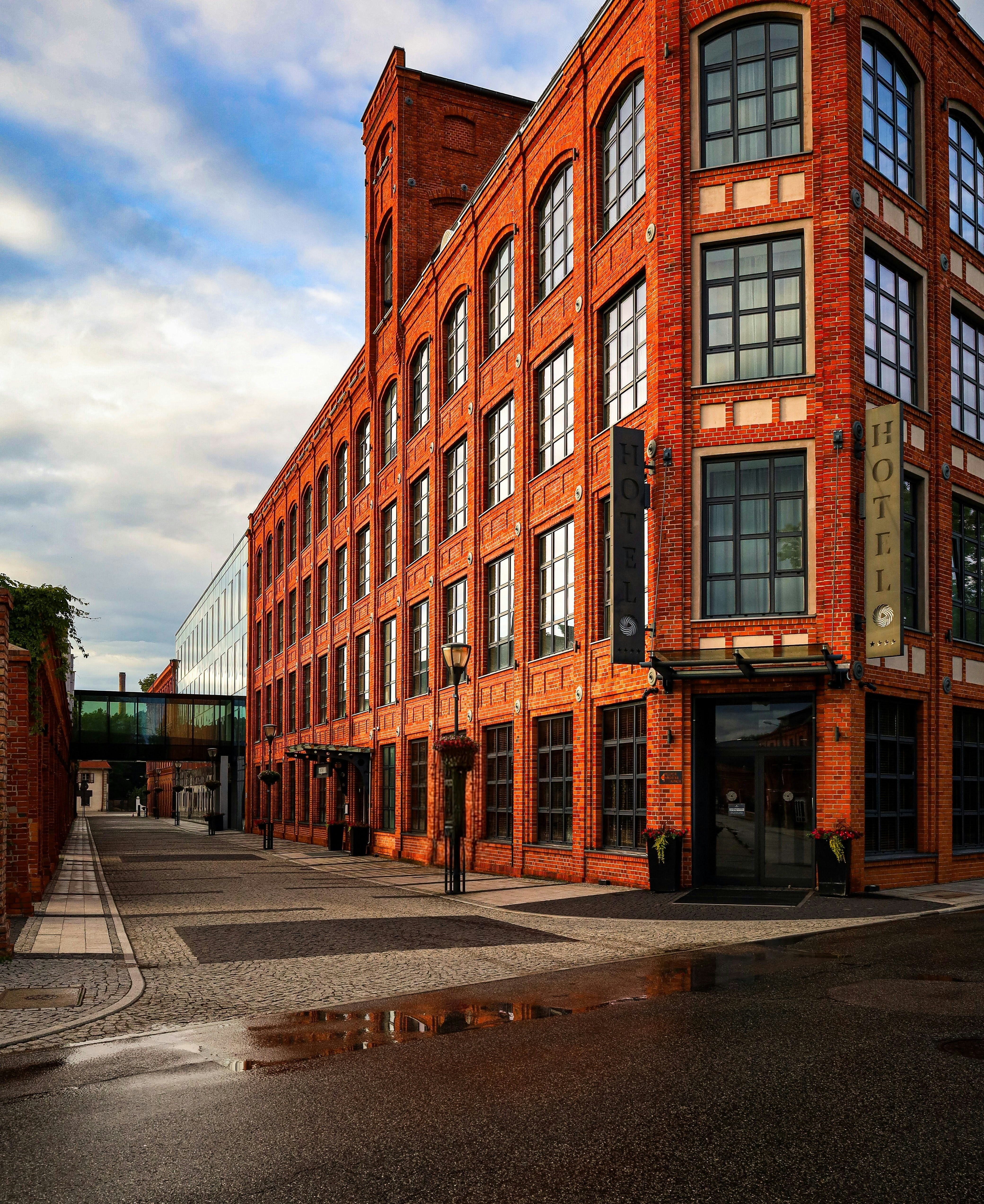 Brickwork Echo: A Red-Brick Hotel Facade Along a Quiet Street