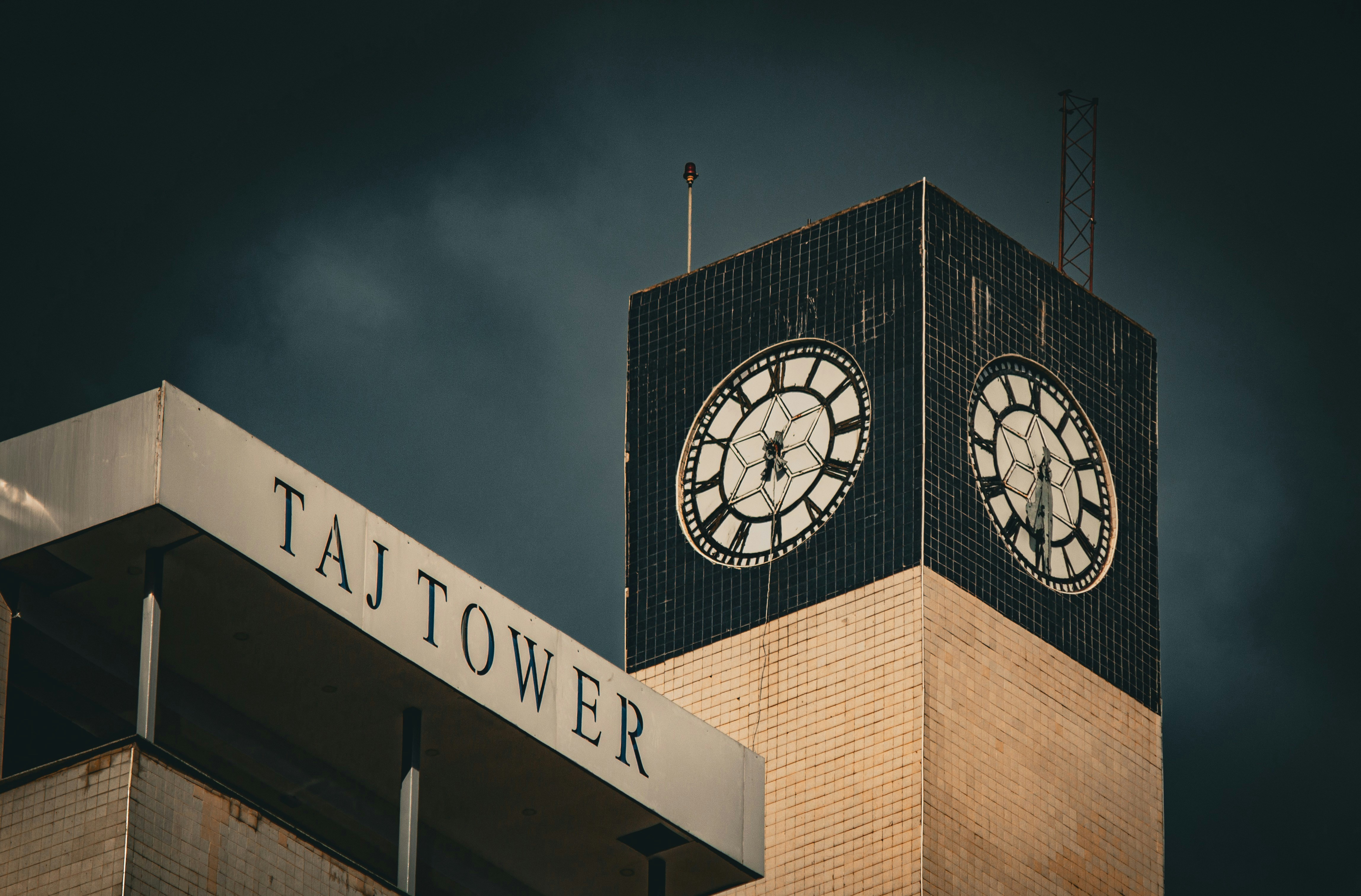 Timeless Facade: The Clock Tower Over Taj Tower