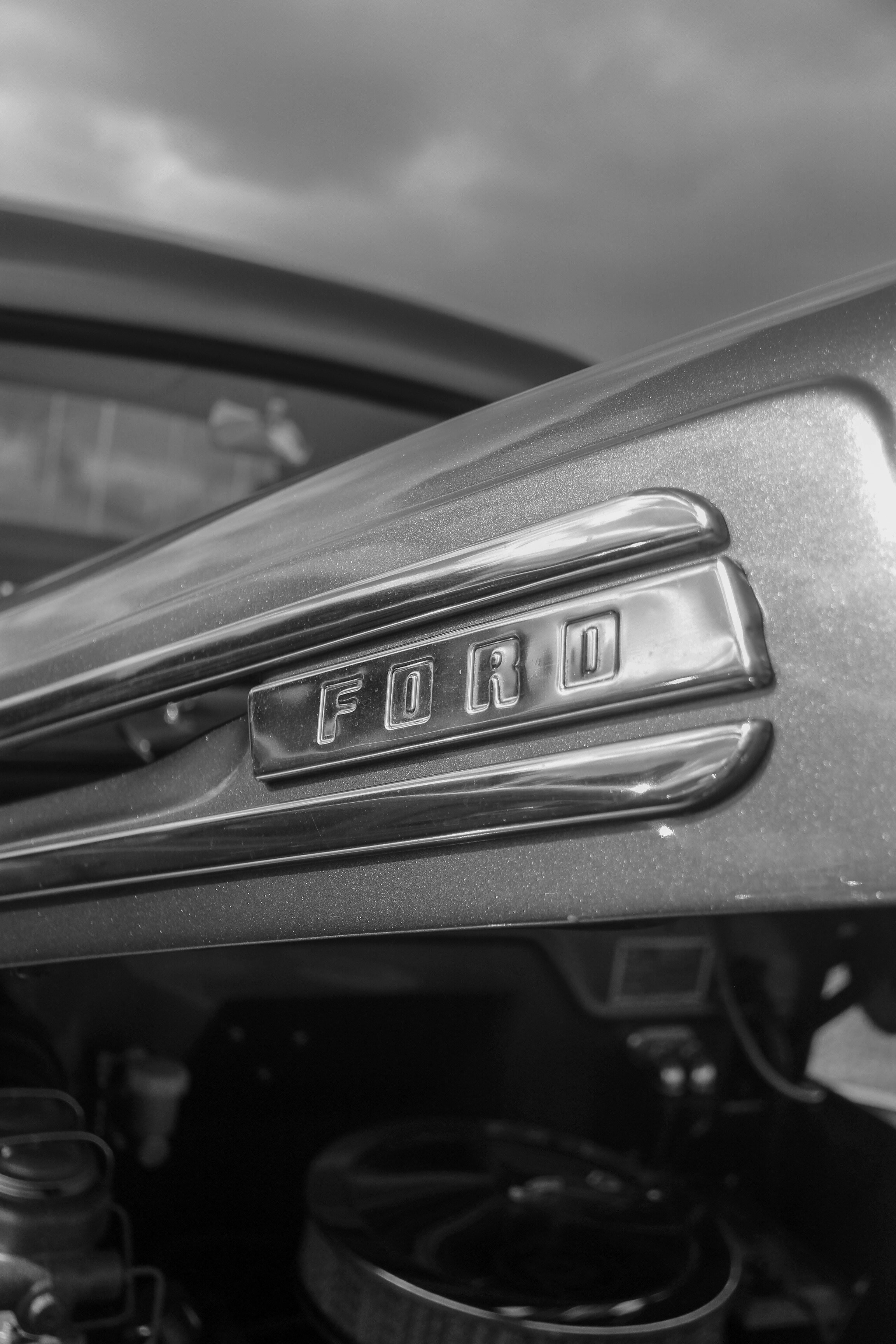 Chrome Ford Emblem on Vintage Car Hood