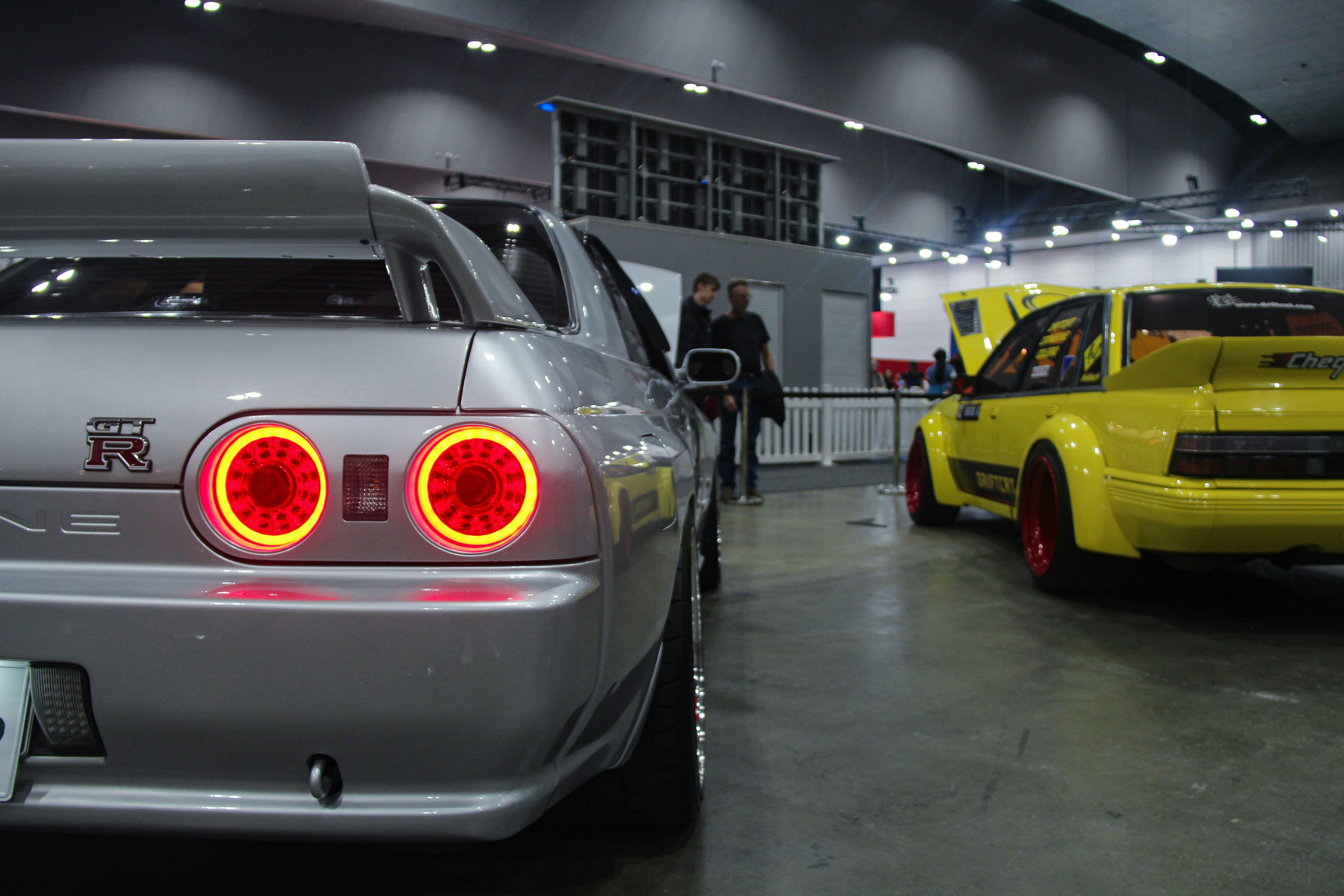 Rear-Quarter Glance: Neon Rings and Racing Echoes at the Show