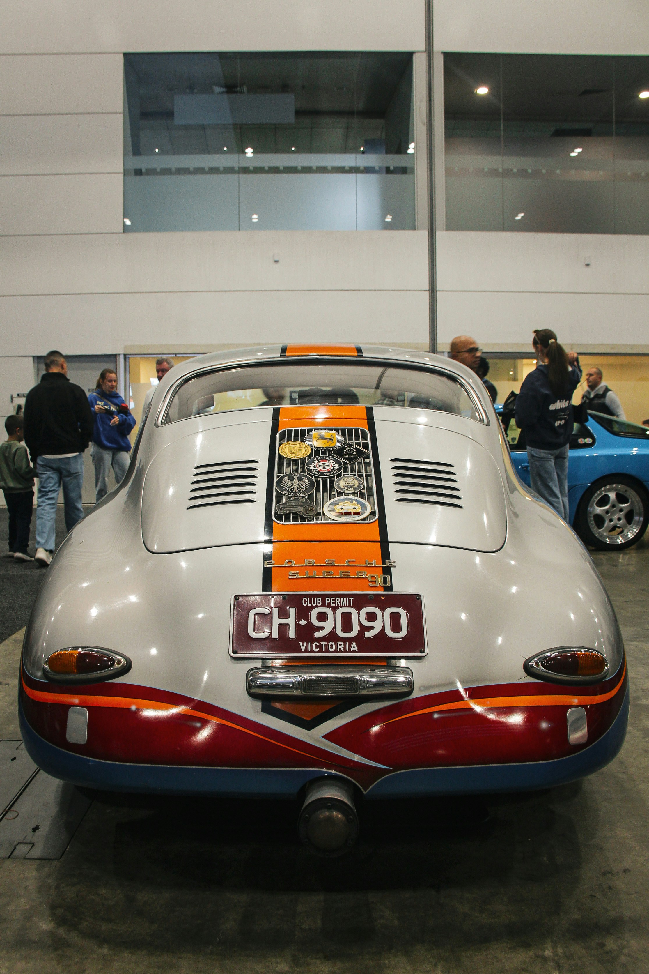 Rear View of a Vintage Porsche Raceway in Silver with Orange Stripes