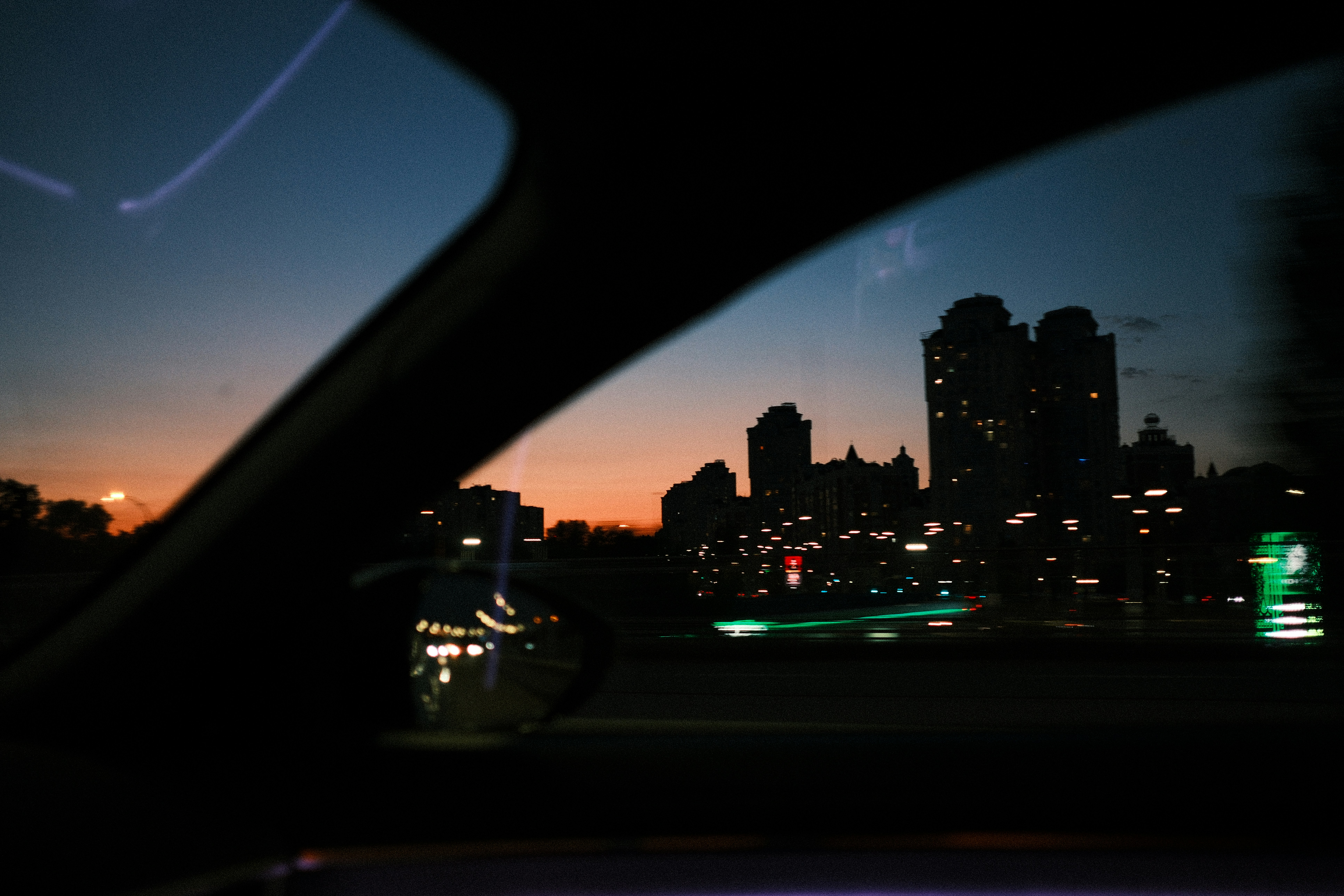 City Lights Through the Car Window at Dusk