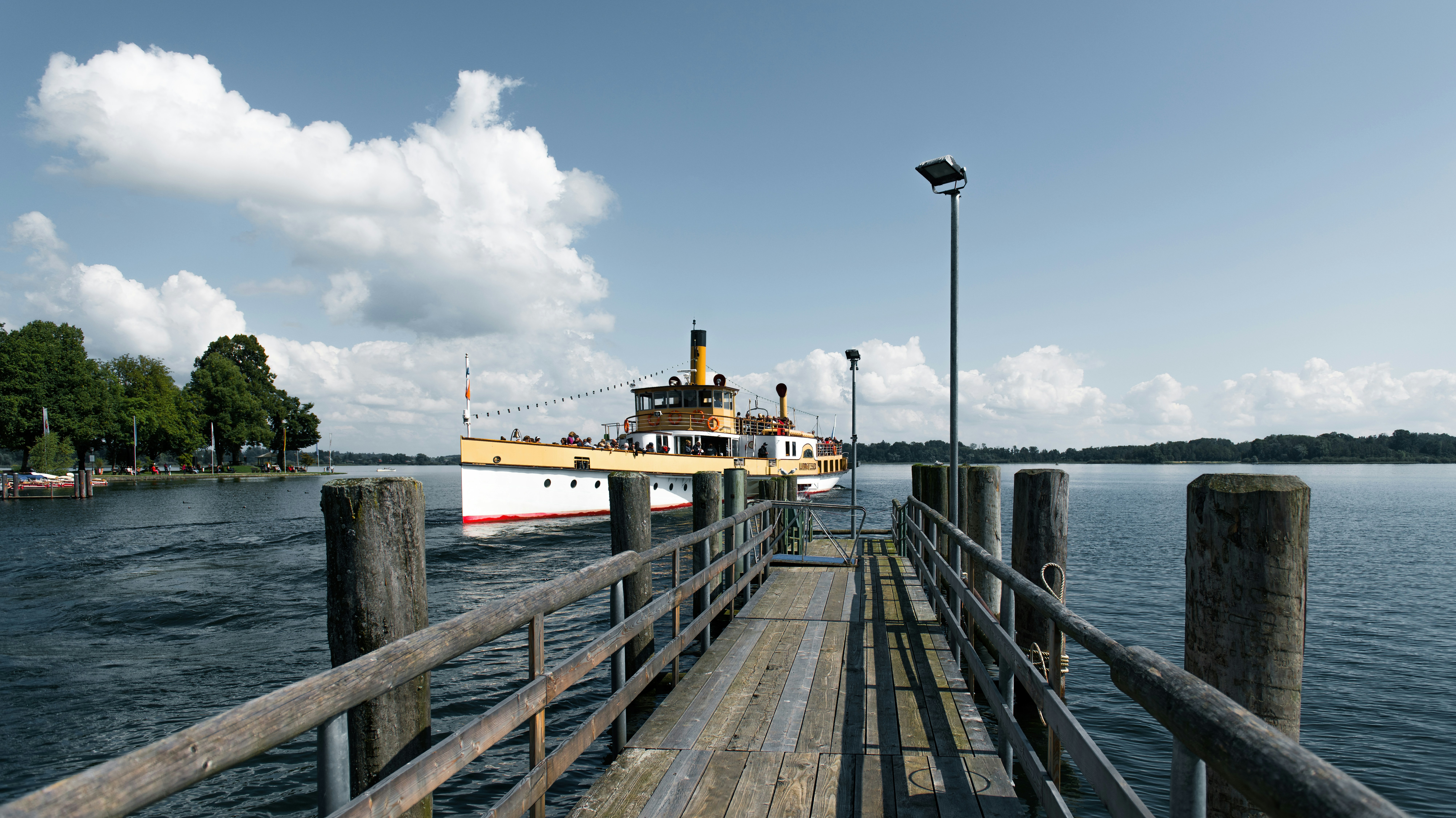 Docked Steam Tug at the End of a Quiet Lake Pier