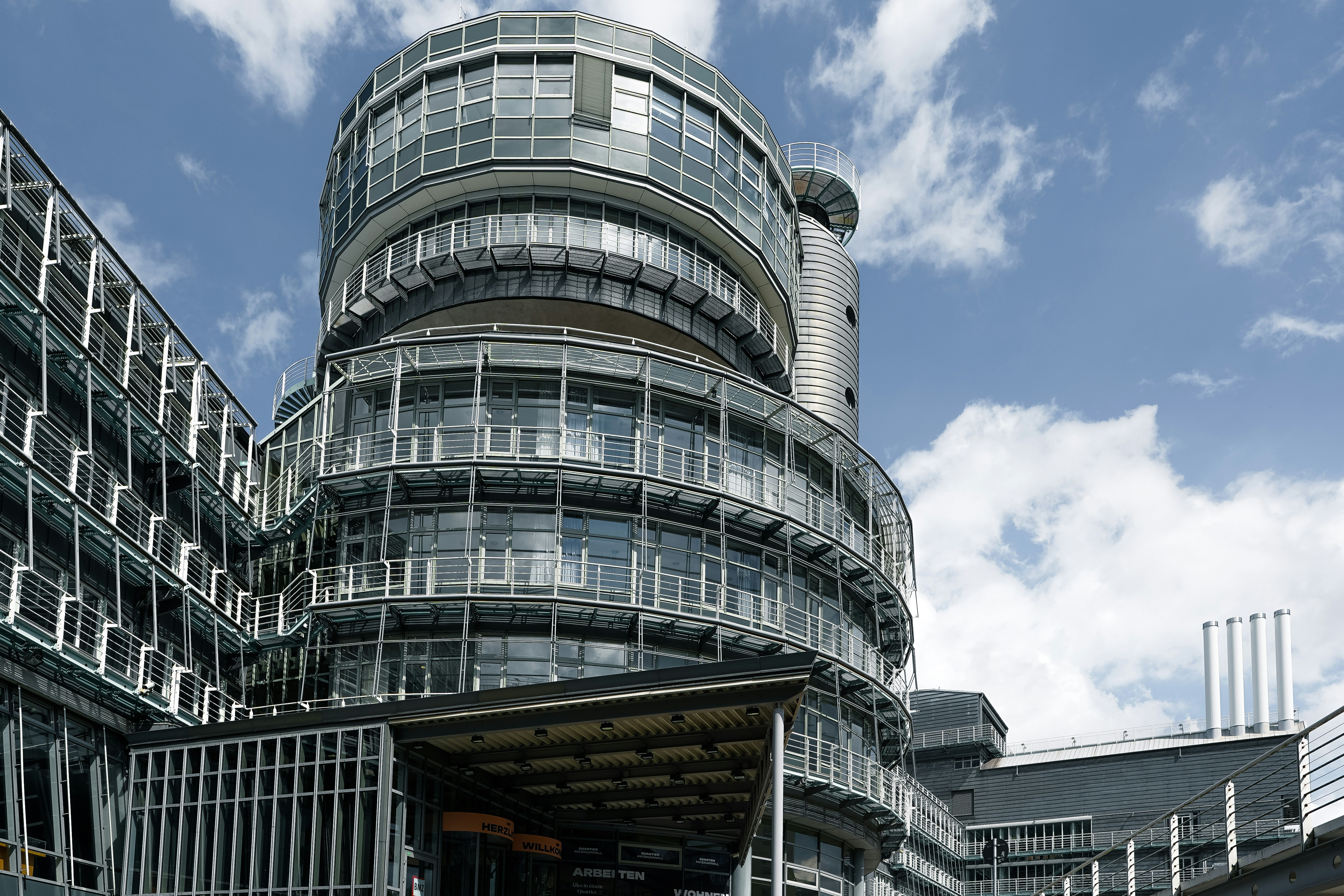 Coiled Glass and Steel: A Skyward Look at the Tiered Circular Tower