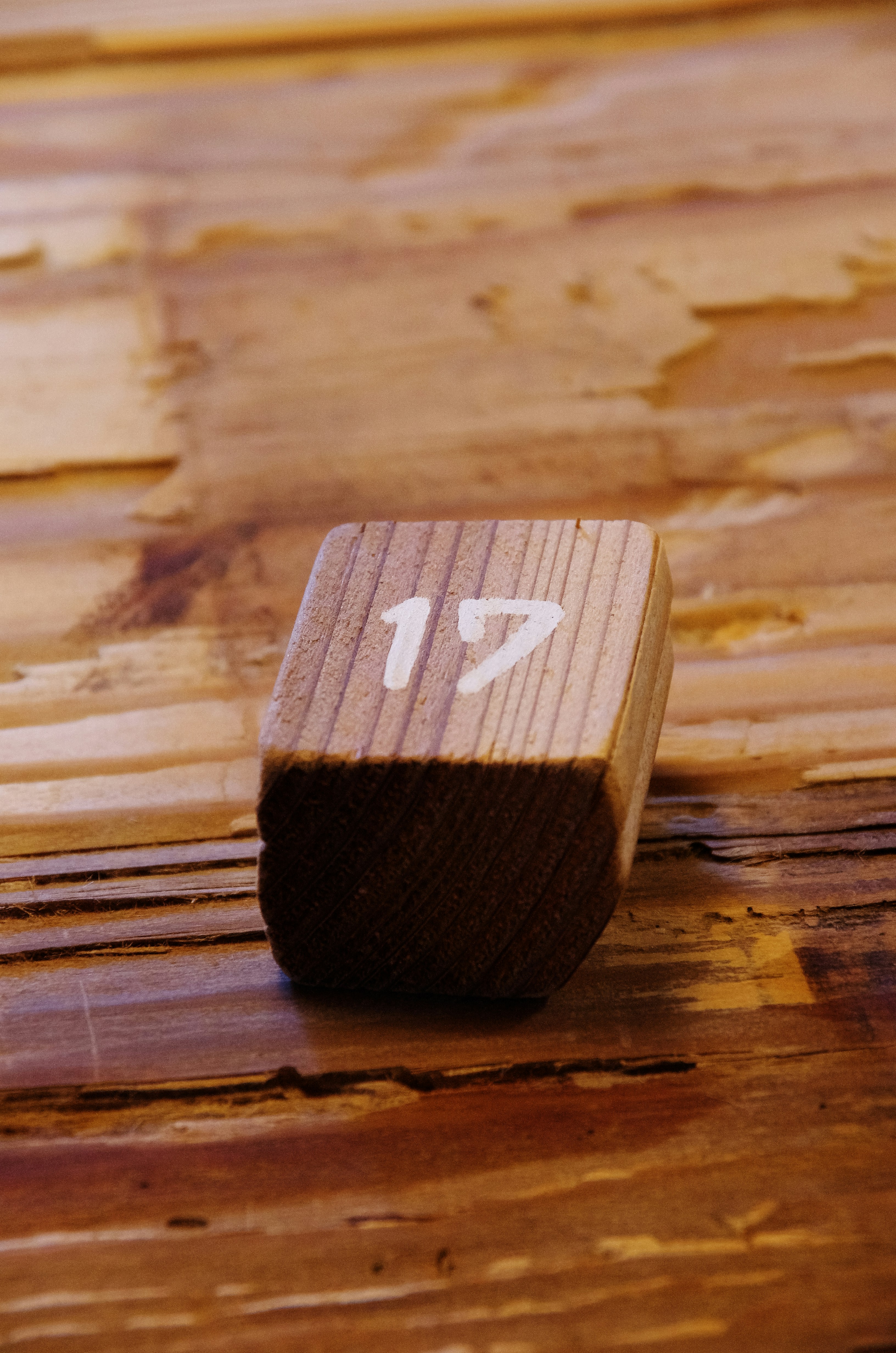 Numbered Block on a Weathered Wooden Surface