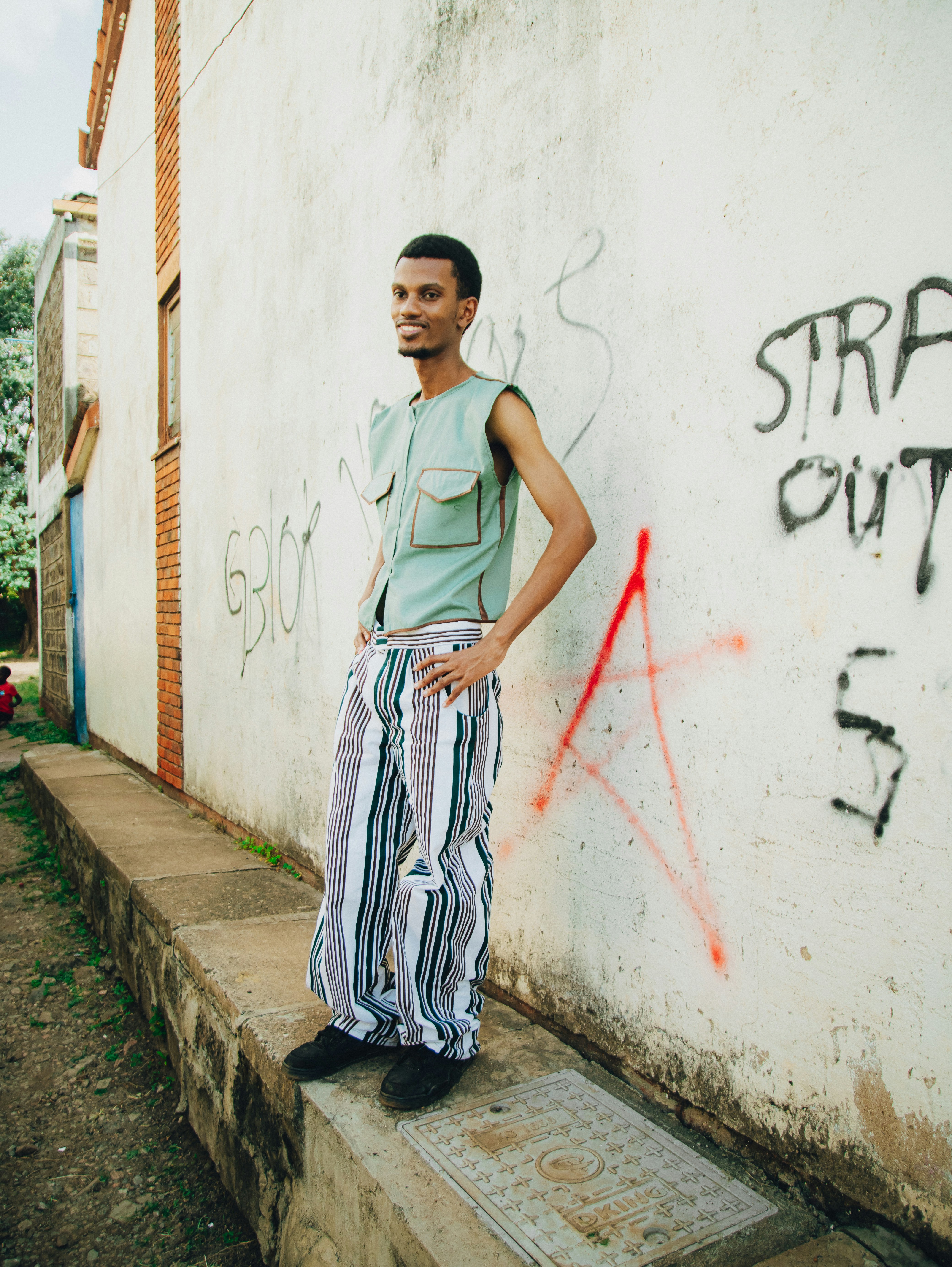 Urban Pose: A Street Portrait against Graffiti Slate
