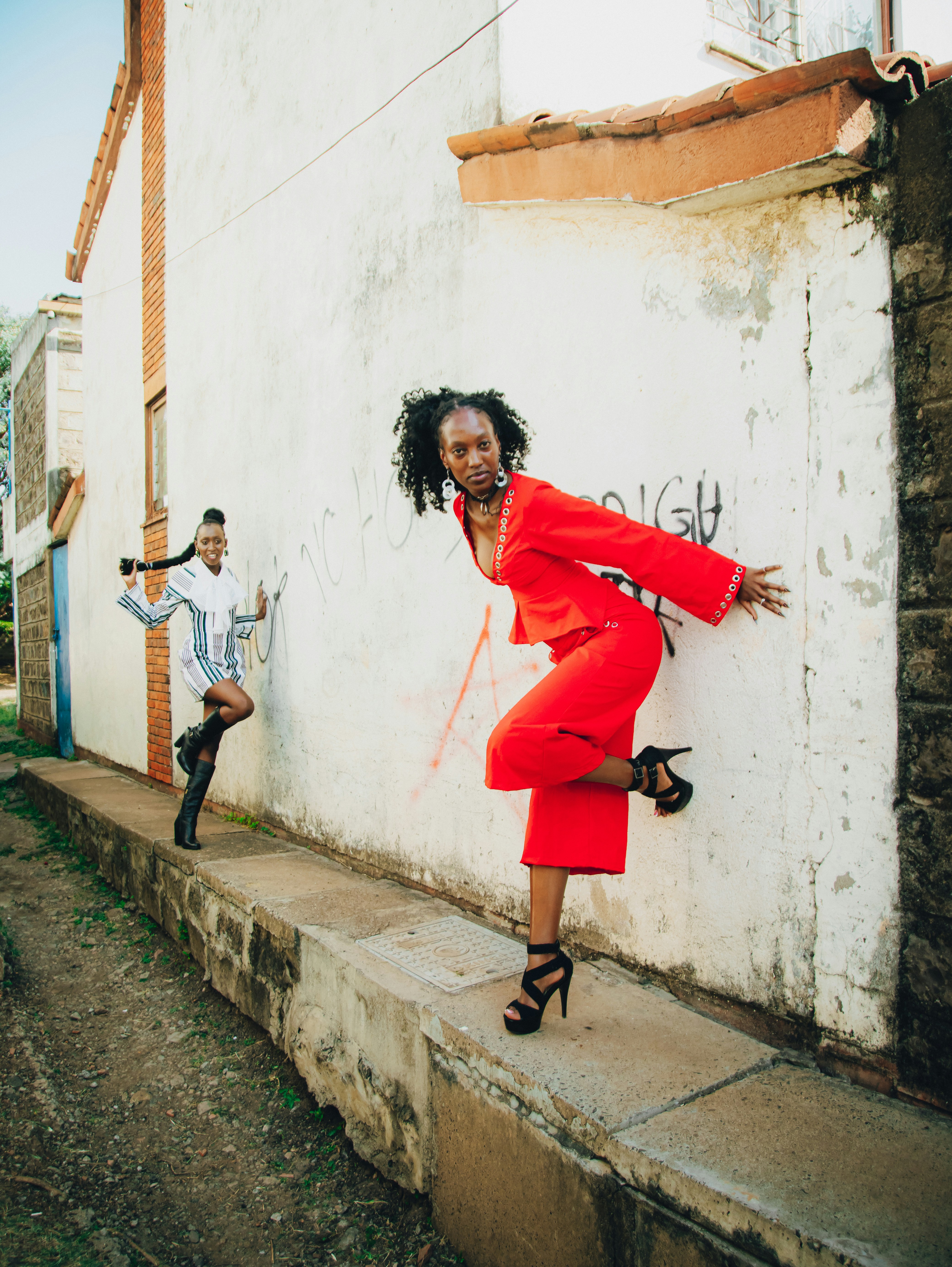 Bold Red Trace: A Duo in Urban Muse