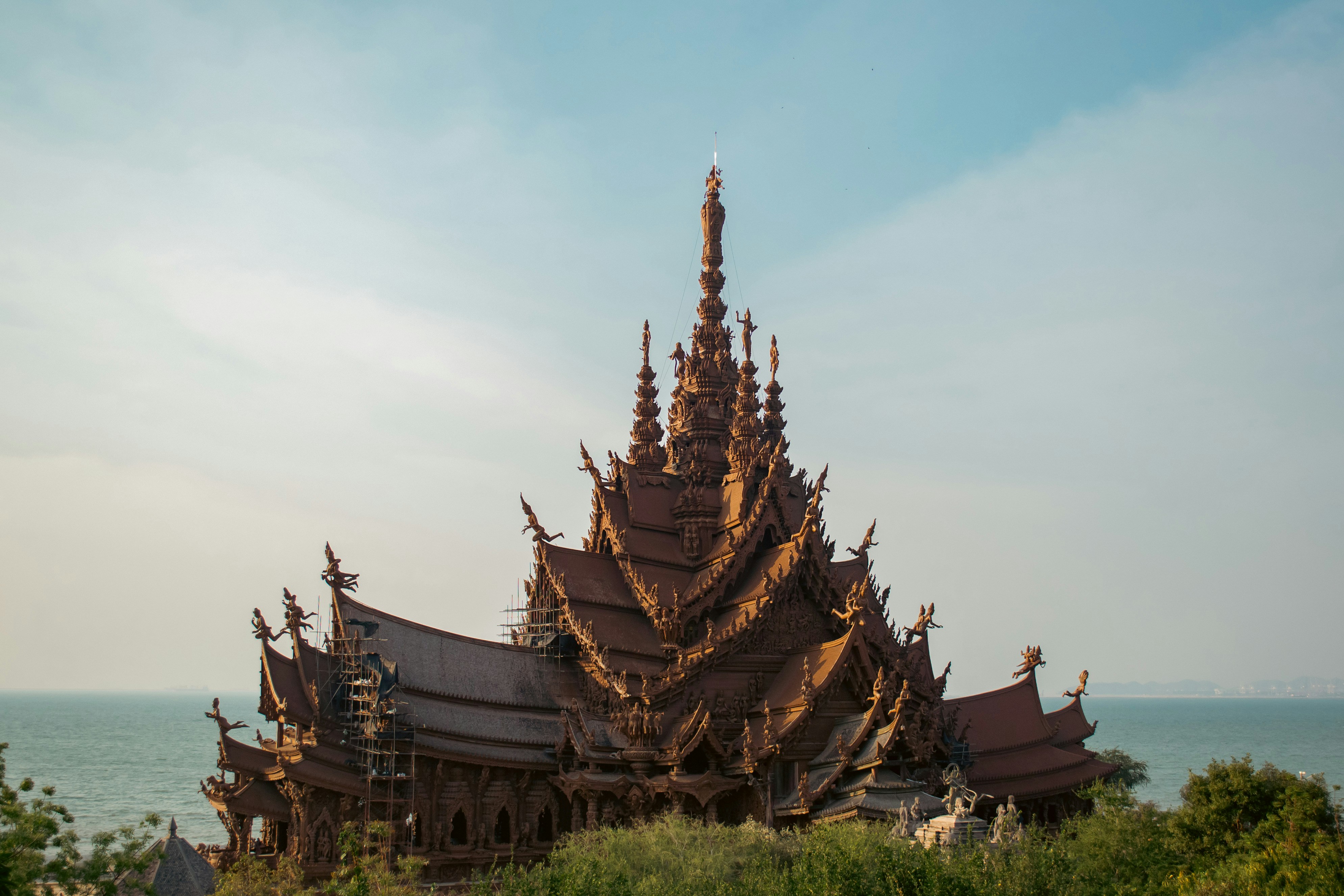 Dragon-Scaled Spire Rising from Coastal Garden