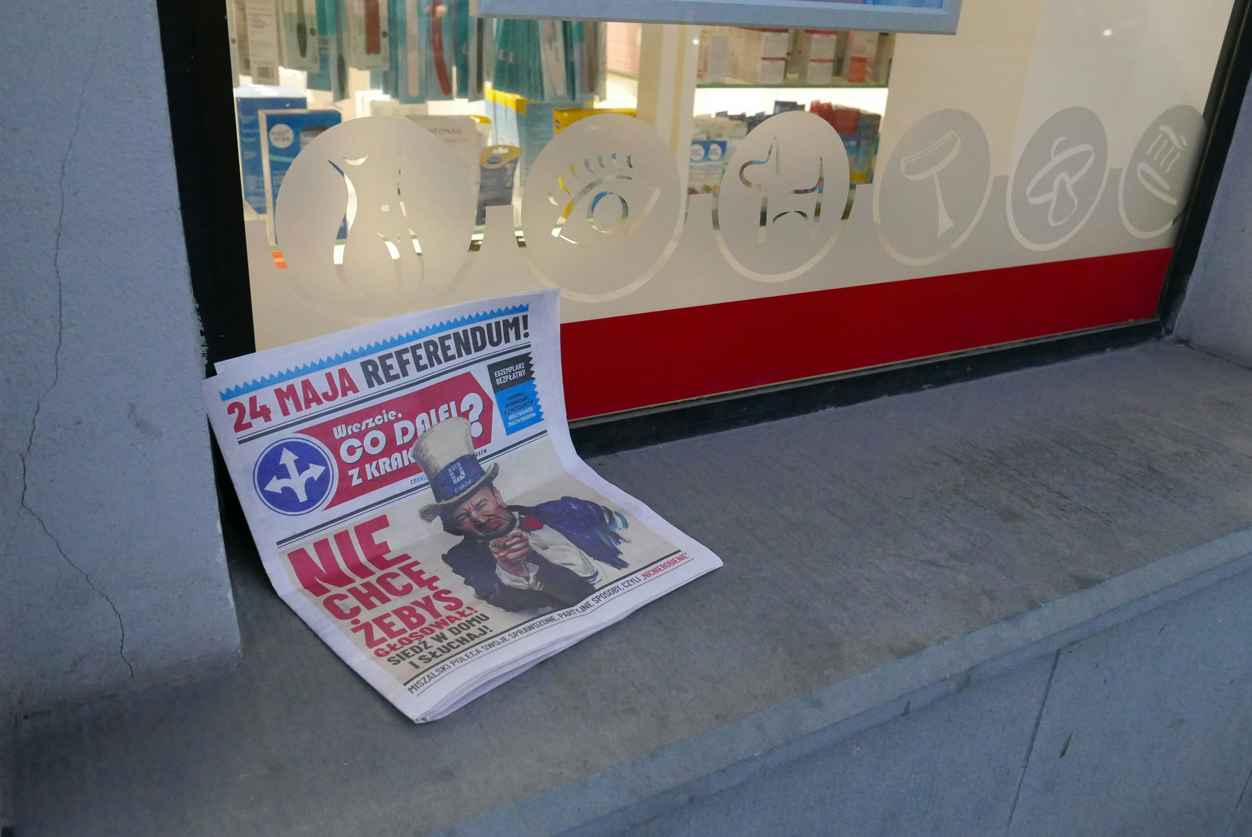 Newspaper on a Concrete Window Sill After a Street News Rally