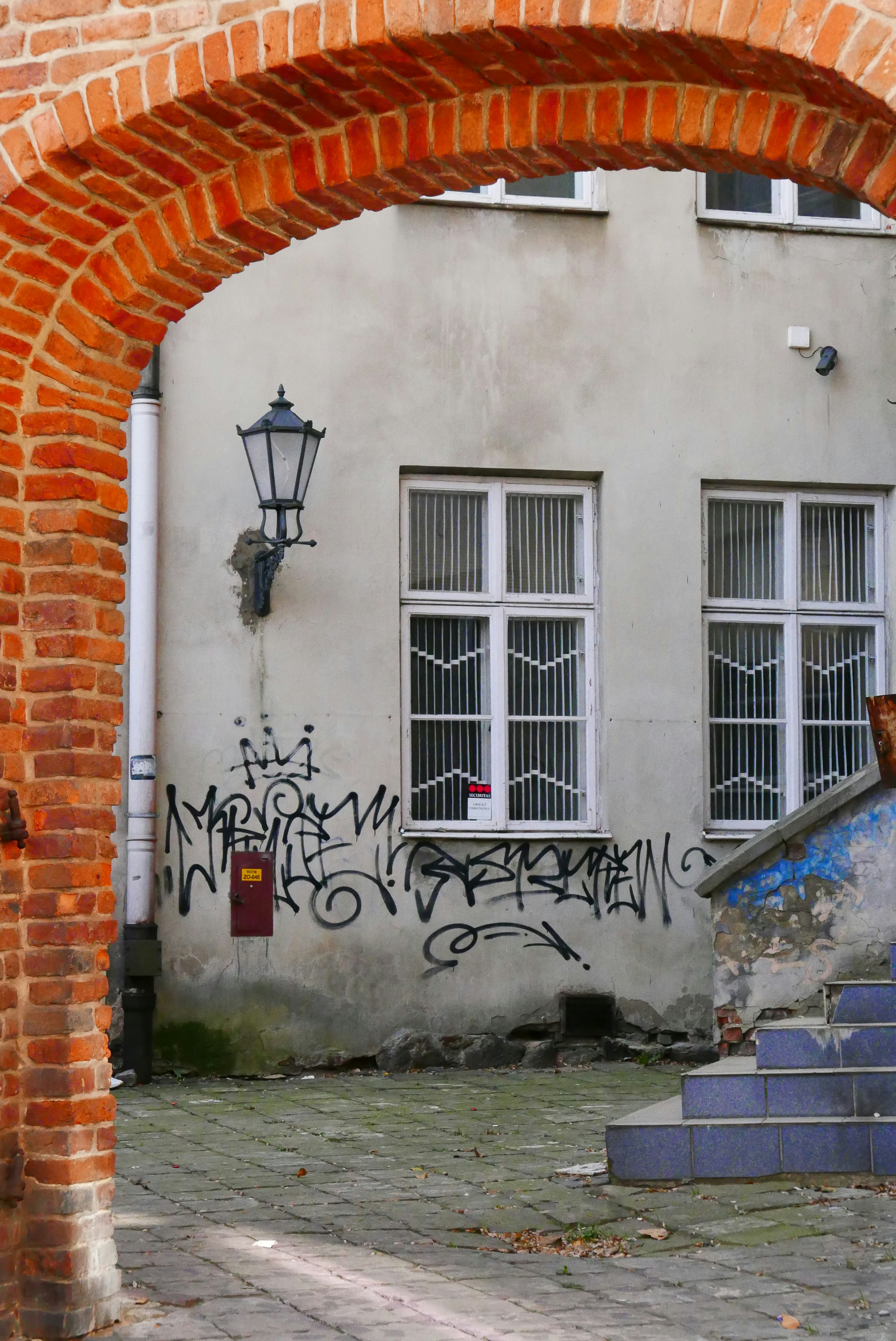 Archway Framing and Graffiti Courtyard