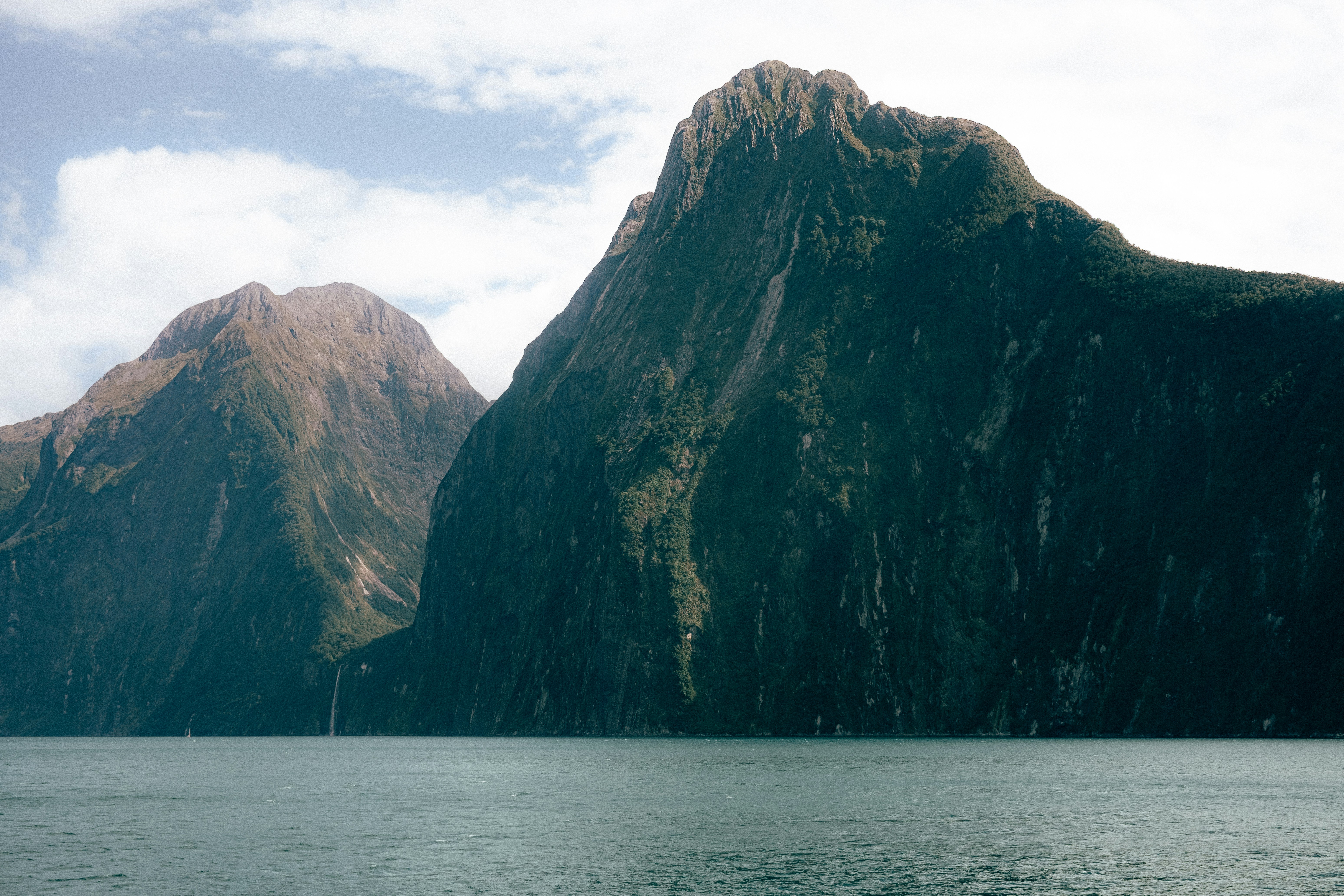 Twin Peaks Above a Quiet Fjord