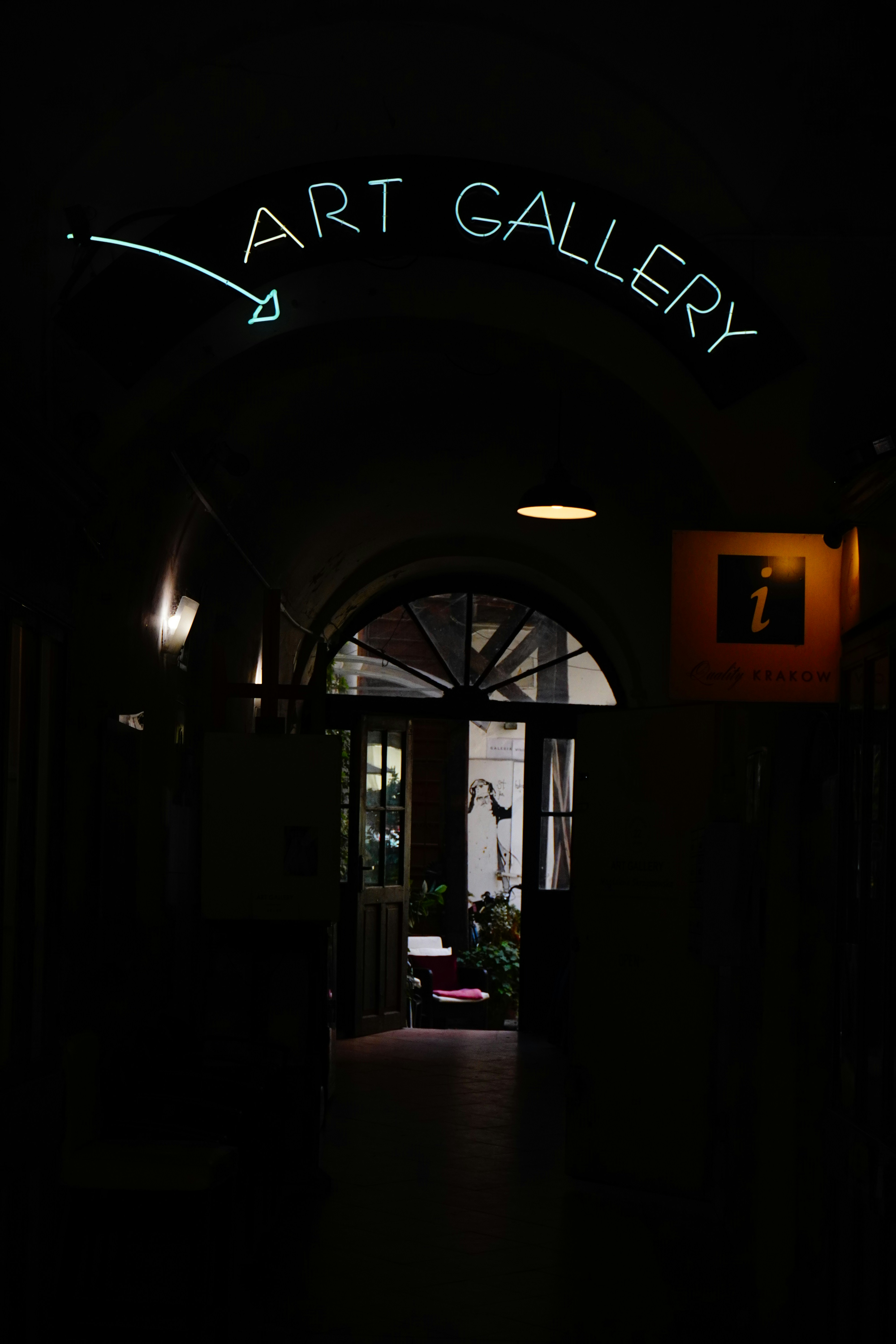 Neon Arrow at the Entrance: Quiet Gallery Corridor