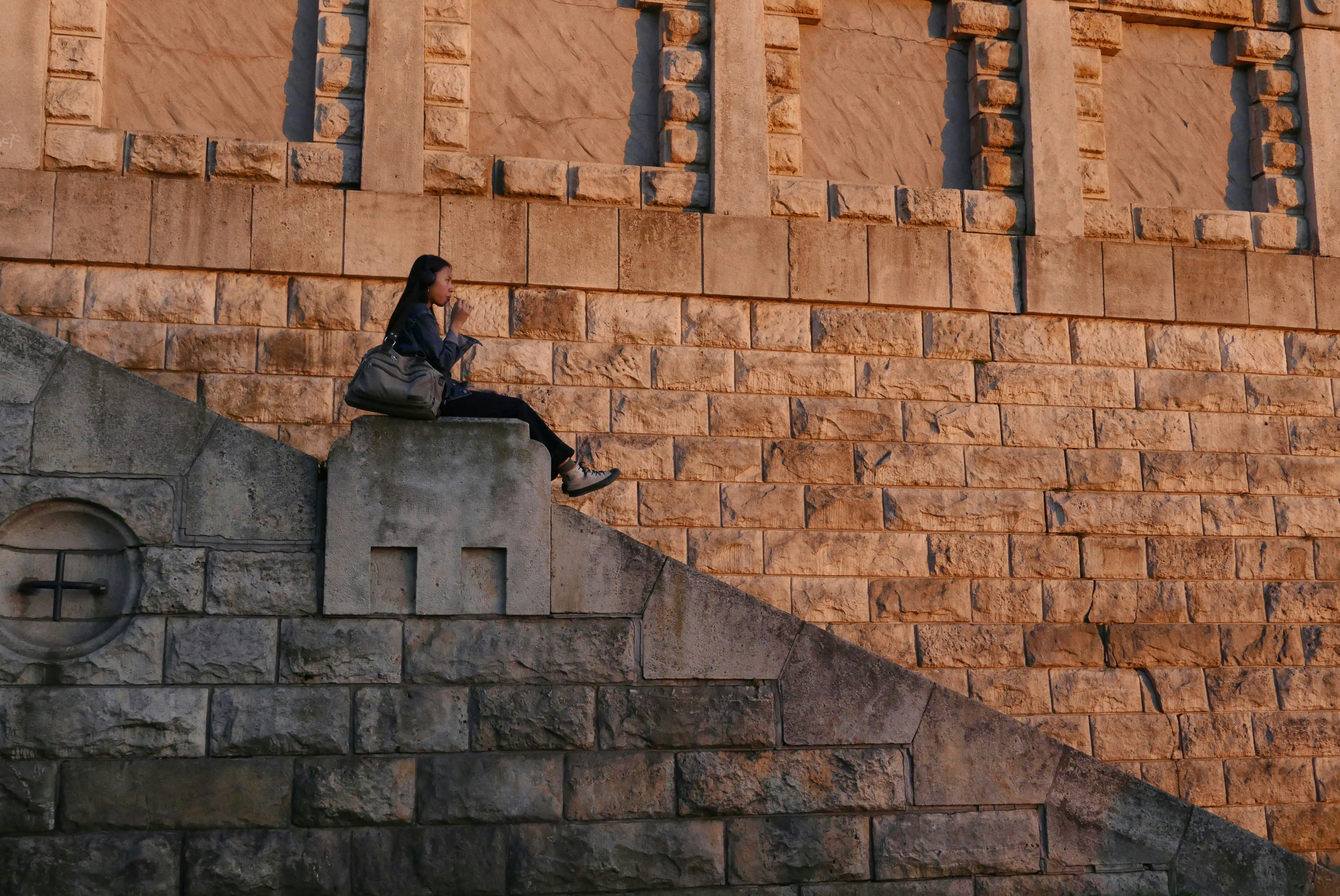 Solitary moment on sunlit stone stairs